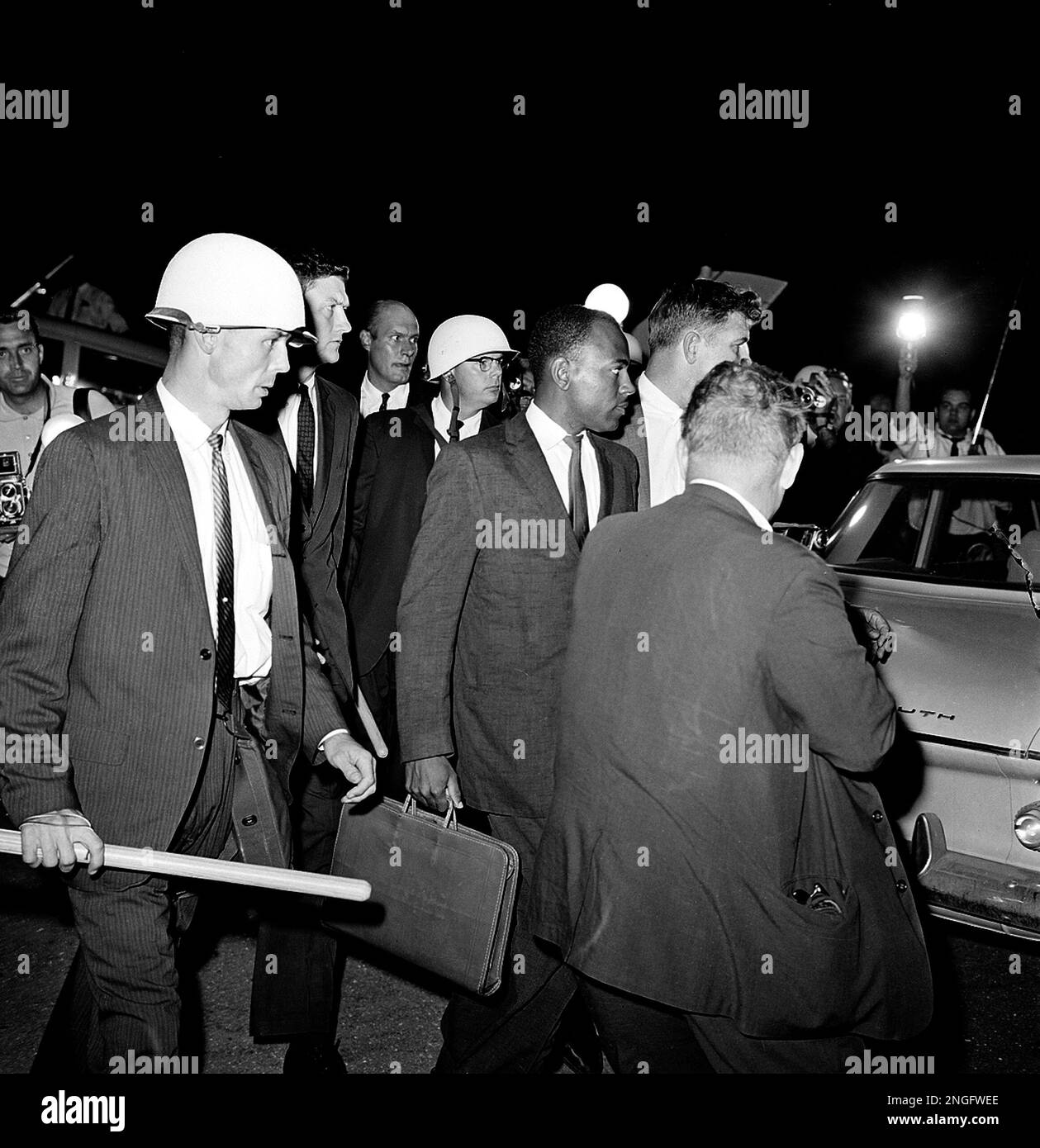 James H. Meredith, center, is escorted by federal marshals as he ...