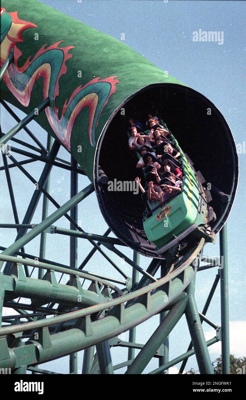 Thrill seekers scream as they come out of the tunnel on the Viper ...