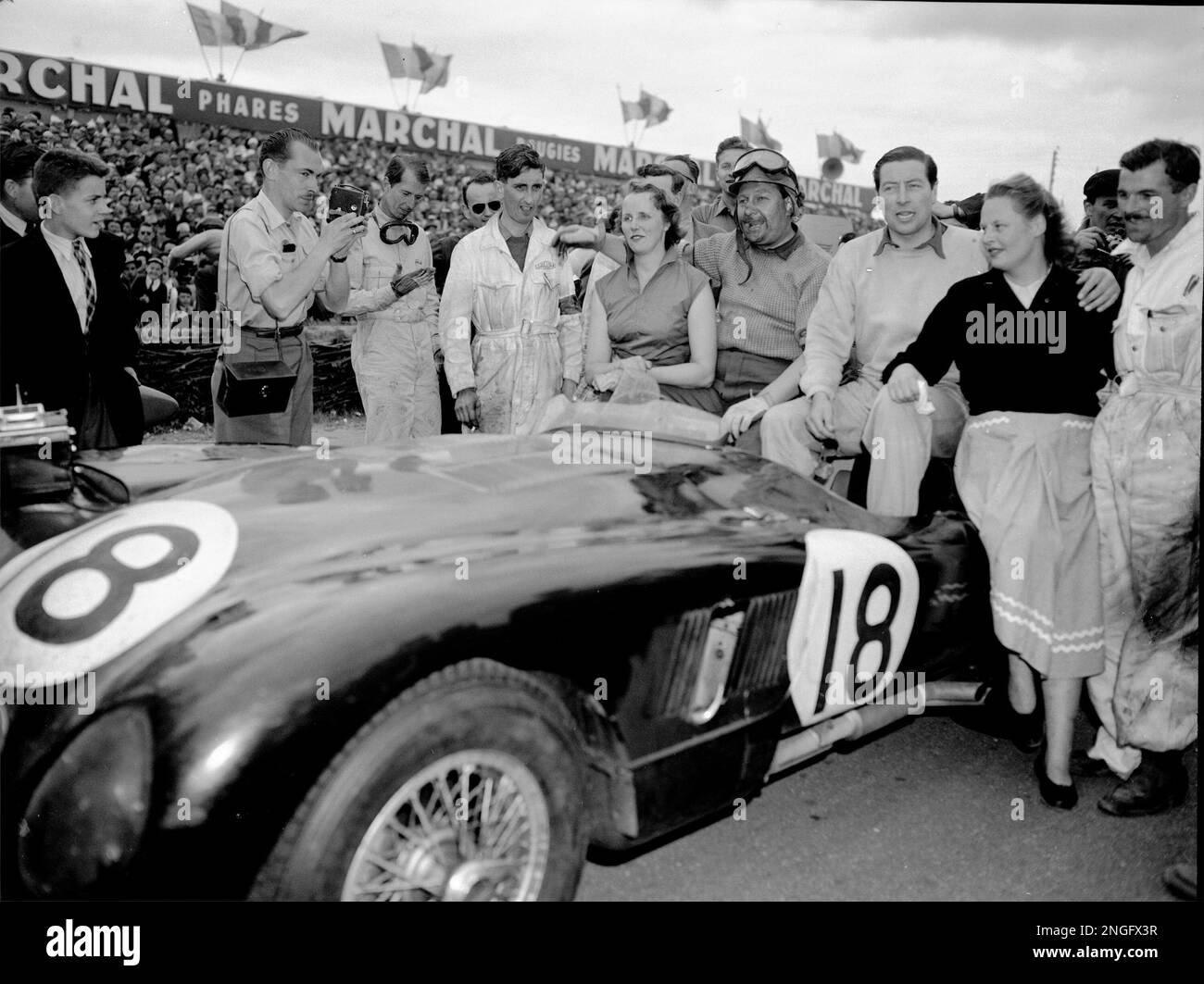 Duncan Hamilton, centre, poses alongside his co-driver Tony Rolt and ...