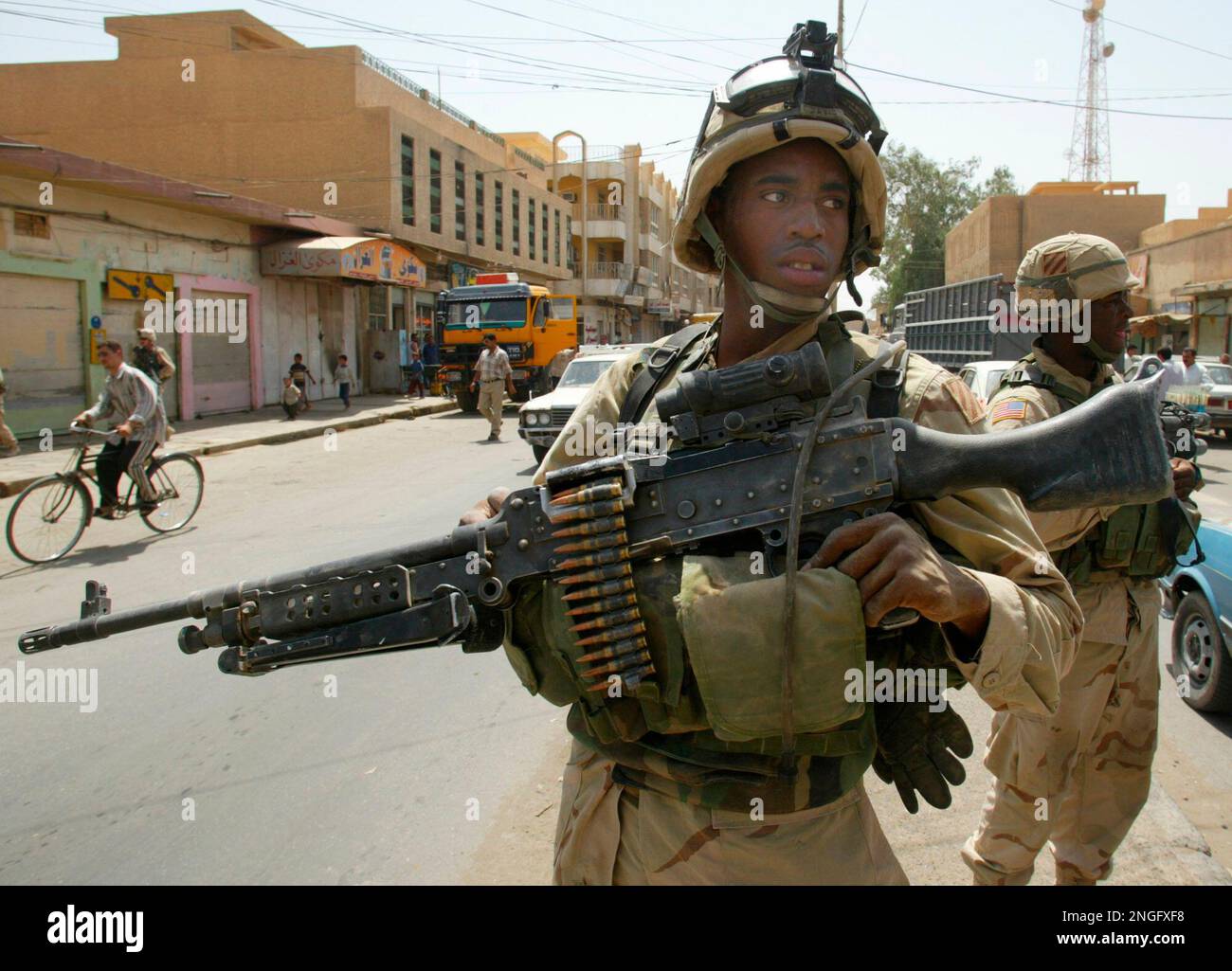 US soldiers patrol a street in Fallujah, Iraq, Saturday June 7, 2003 ...