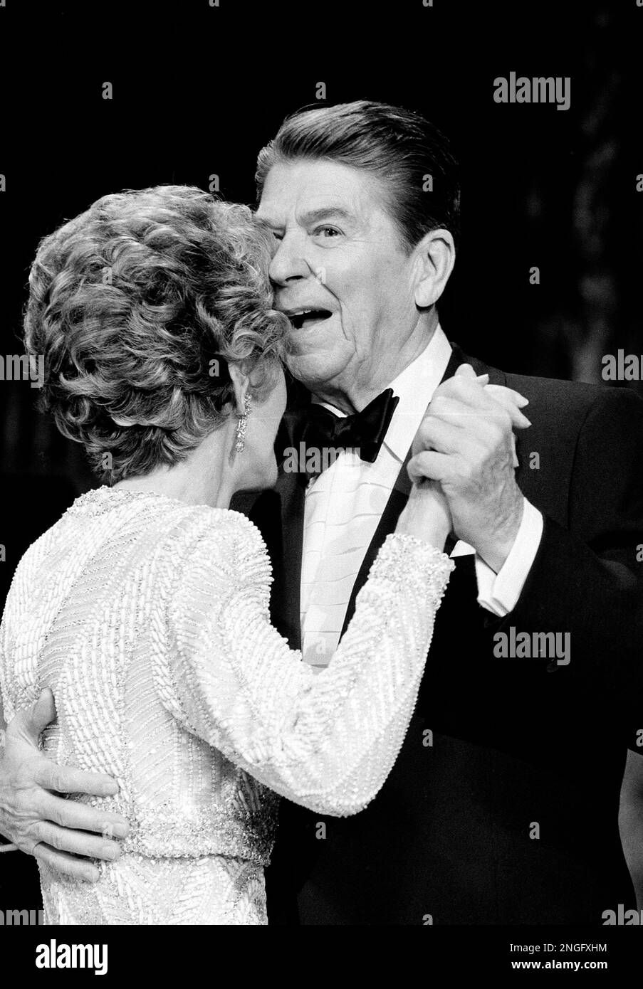 U.S. President Ronald Reagan and first lady Nancy Reagan dance during ...