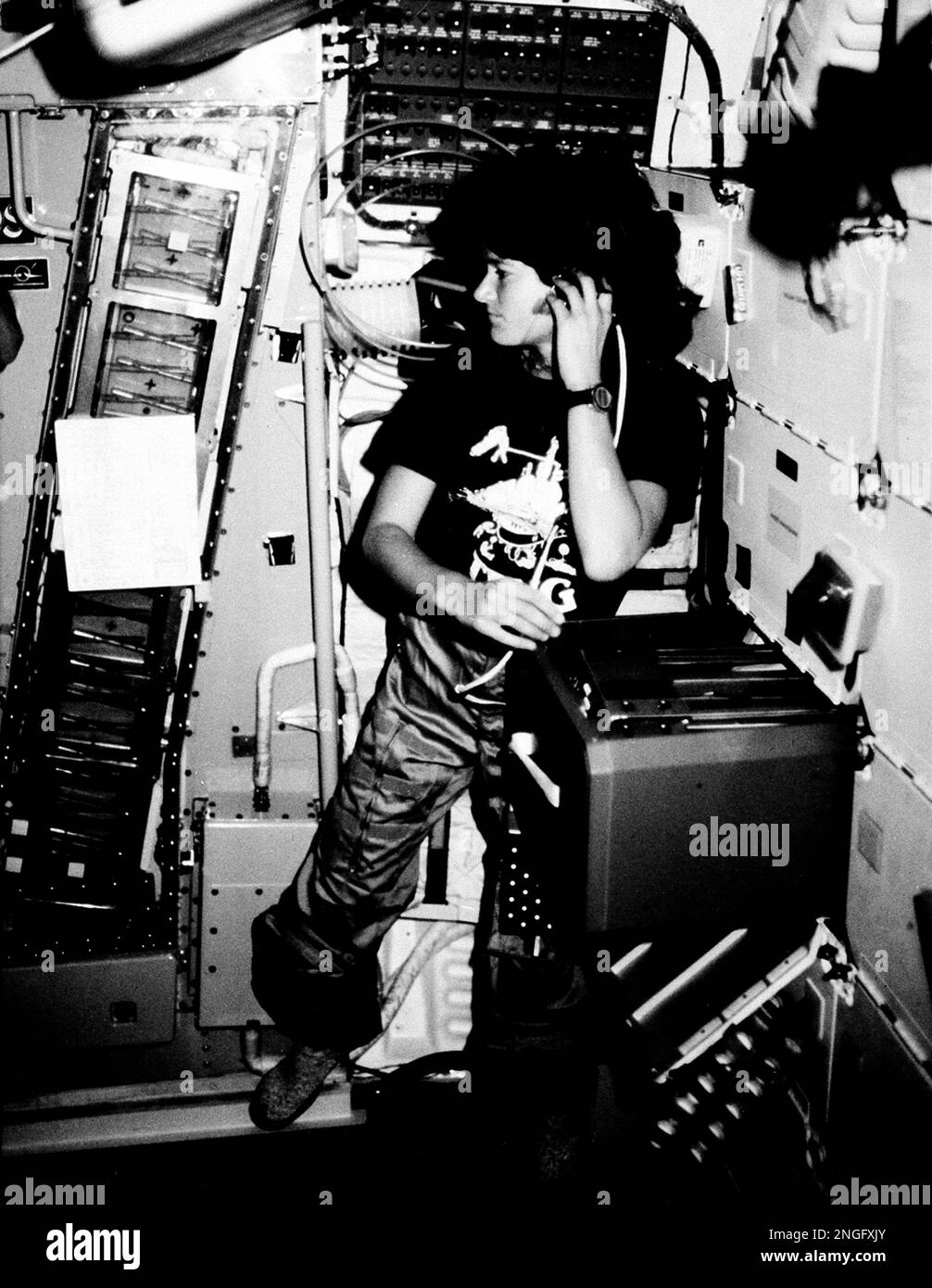 Astronaut Sally K. Ride, STS-7 mission specialist, communicates with ...