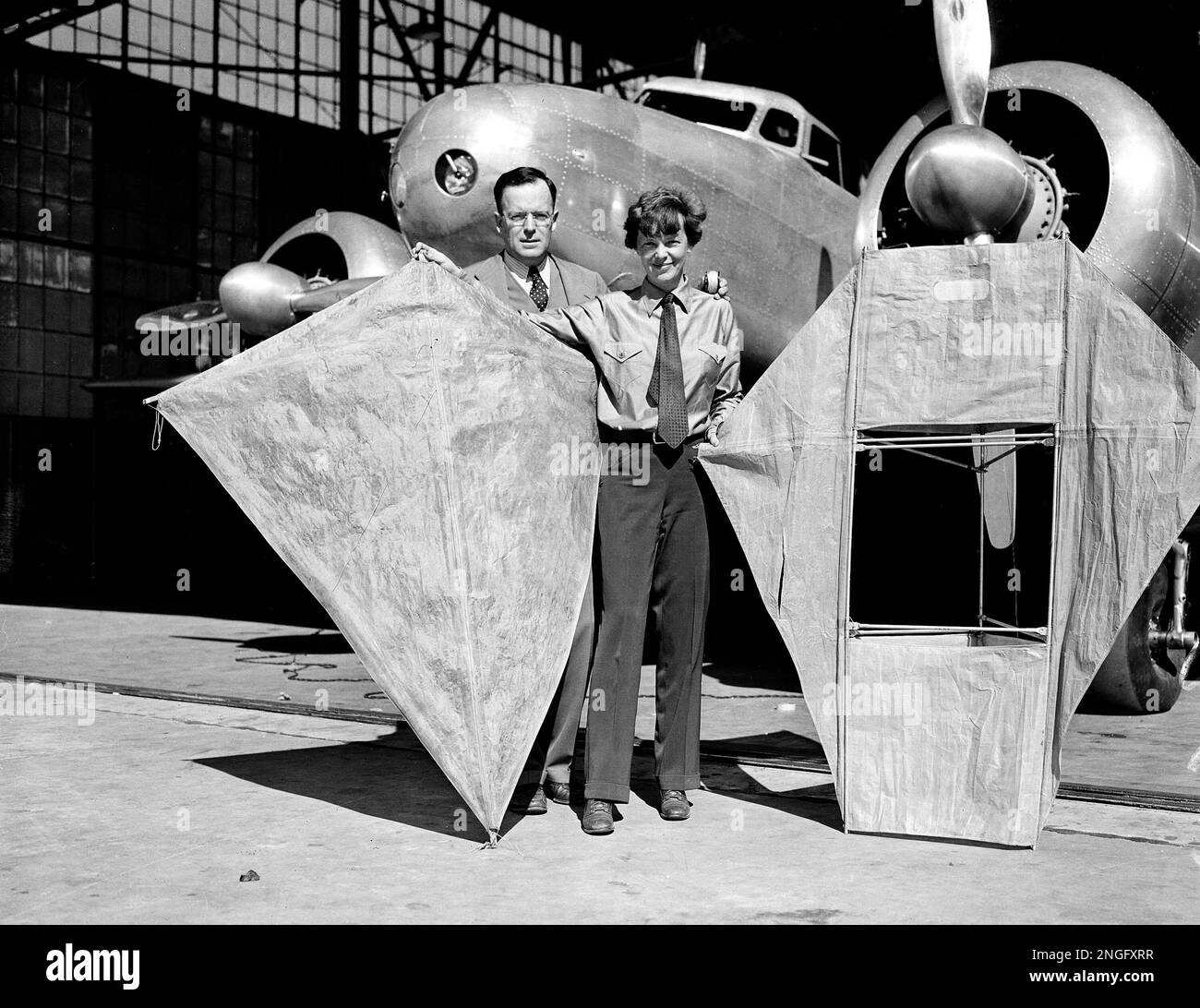 Amelia Earhart Putnam and her husband George Palmer Putnam display two ...
