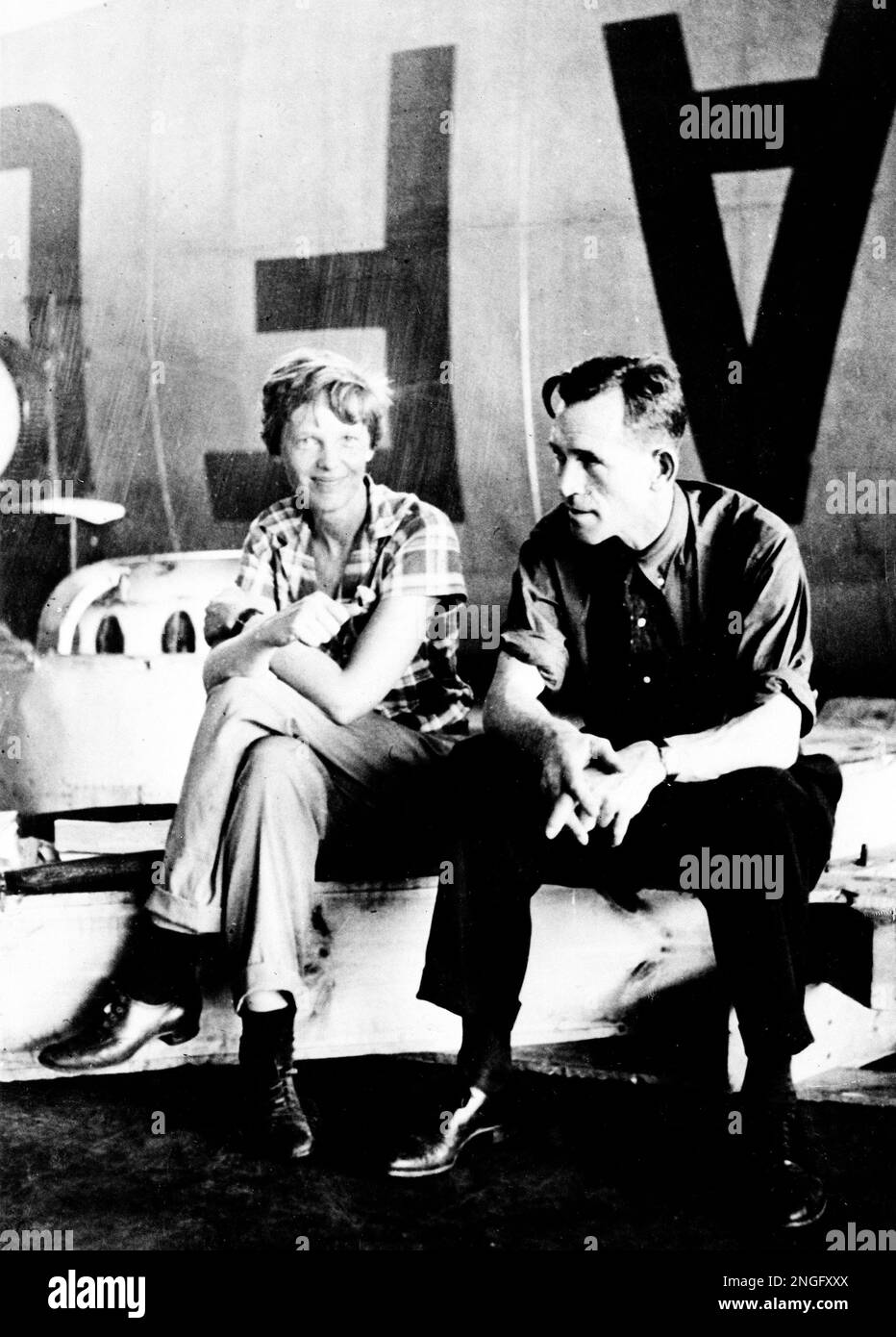 Amelia Earhart Putnam and her navigator Fred Noonan are seen shortly ...