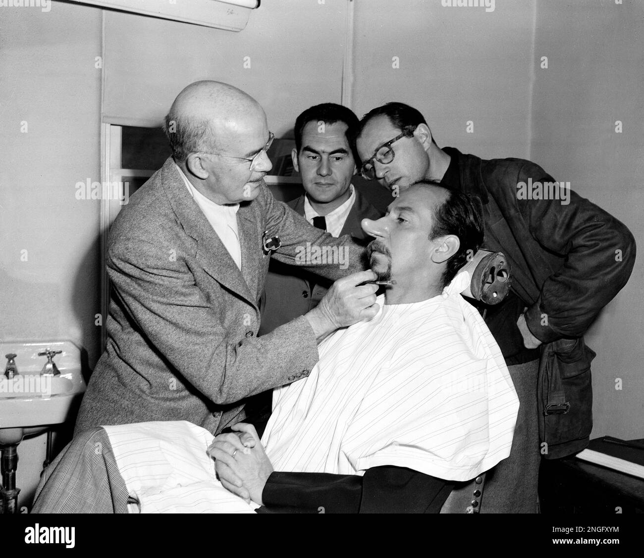 Actor Jose Ferrer is outfitted with a nose after trying out 200 noses ...