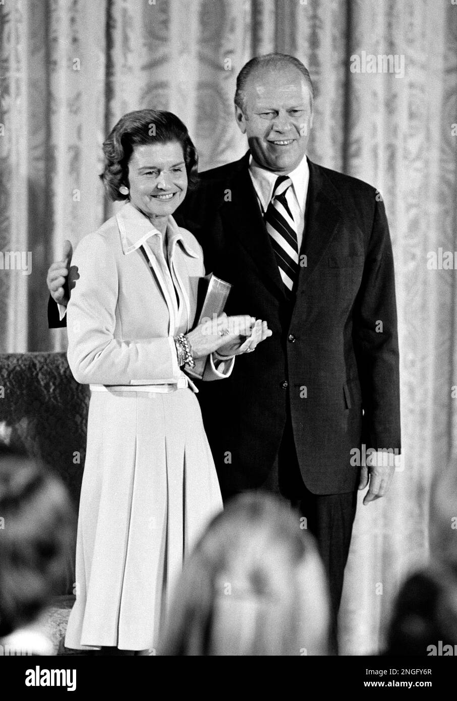 New first lady Betty Ford joins in the applause after her husband ...