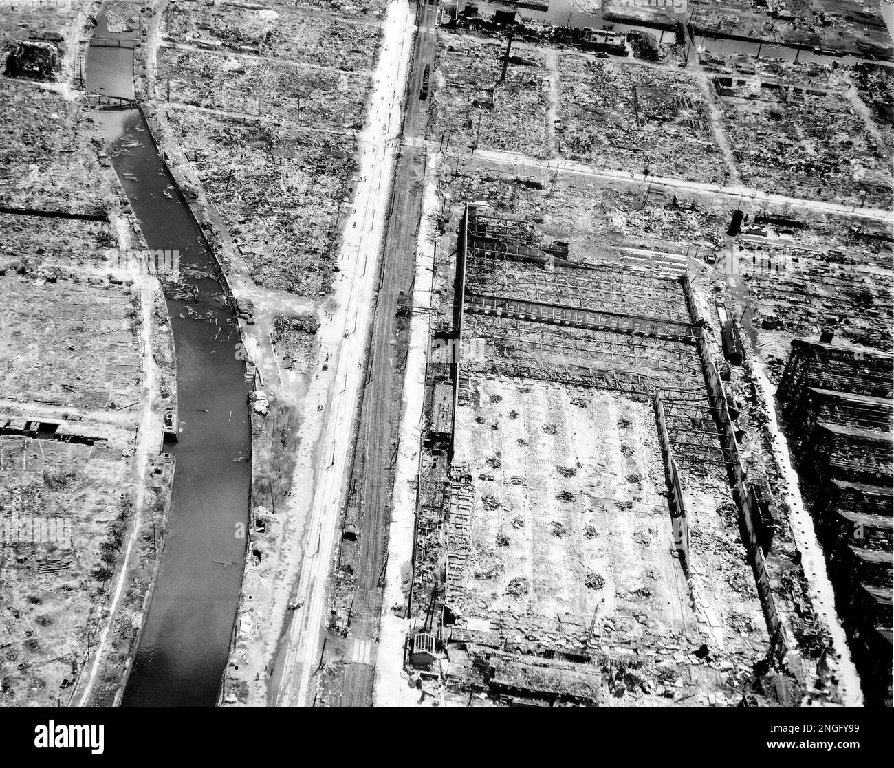 This aerial view shows the extensive damage caused by the atomic bomb ...