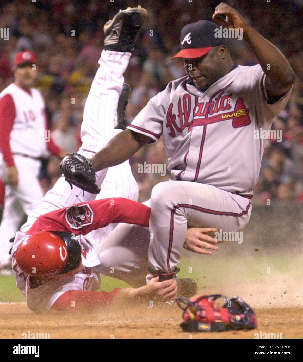 Cincinnati Reds' Austin Kearns, left, is tagged out at home by Atlanta ...