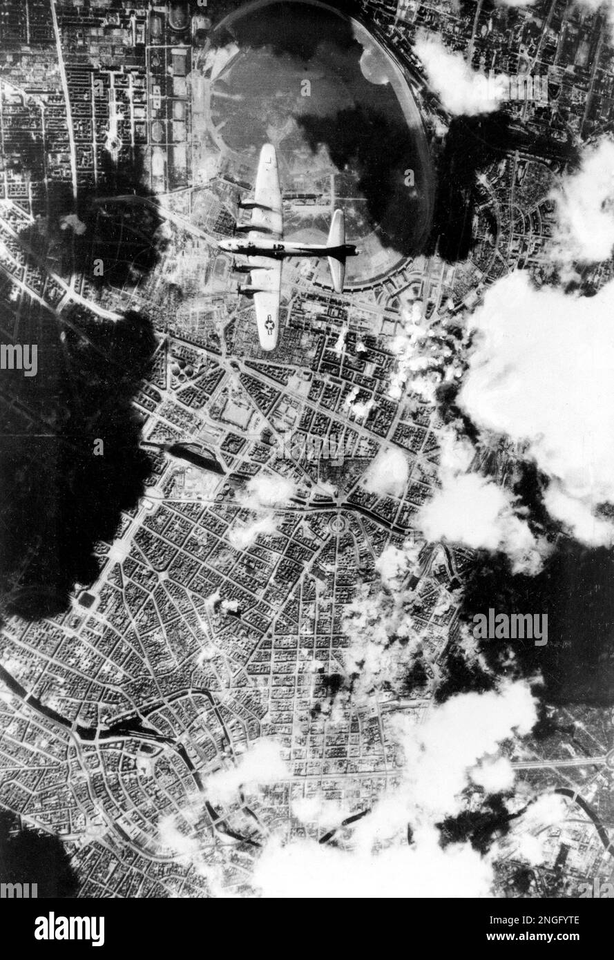 Flying Fortresses and Liberators of the U.S. 8th Air Force wing over Berlin during a daytime air ...