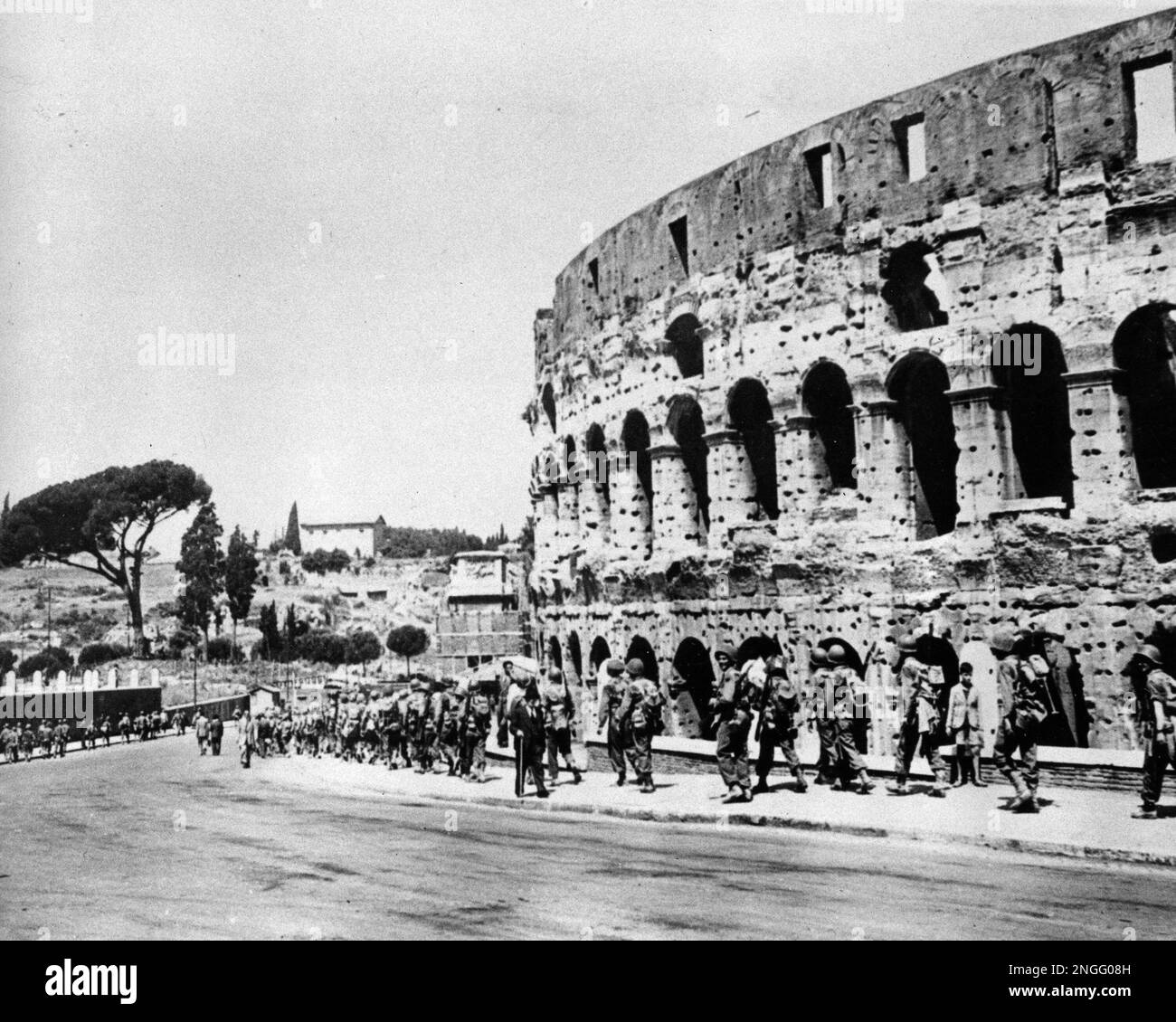 U.S. soldiers are seen as they march past the famous Colosseum in Rome ...