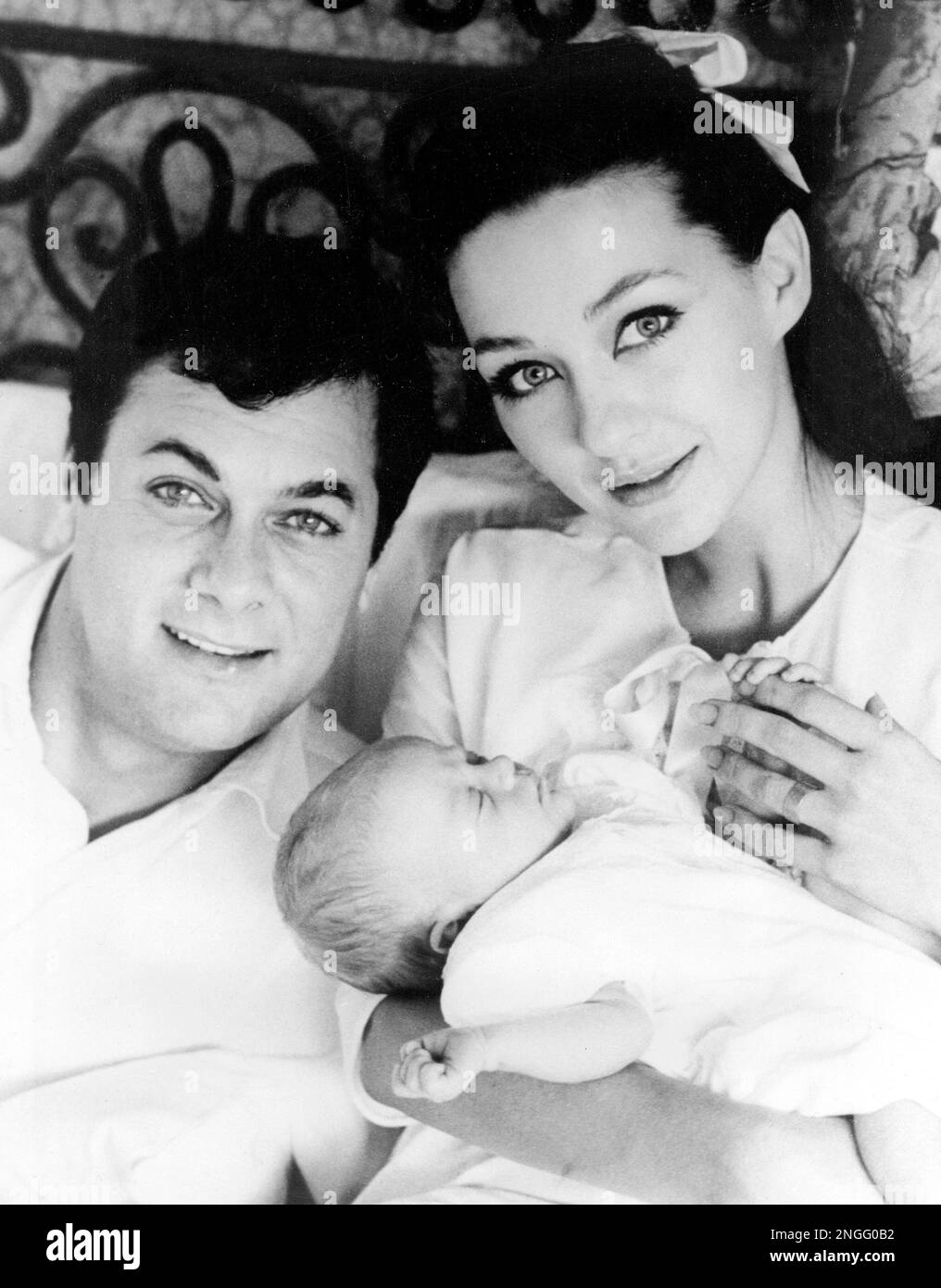 Actor Tony Curtis and Christine Kaufmann pose with their daughter ...