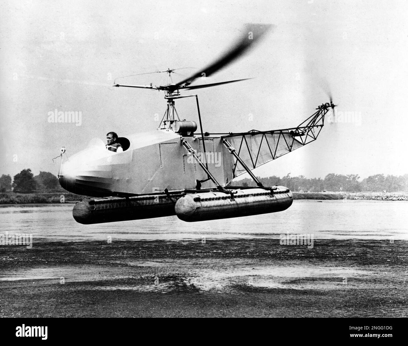 Engineering test pilot Charles L. Morris is at the controls of the ...