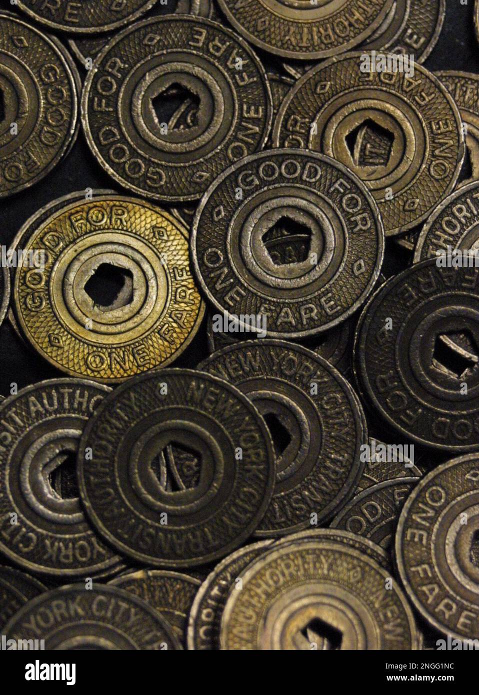 A pile of New York City subway tokens is shown, April 12, 2003 in New ...