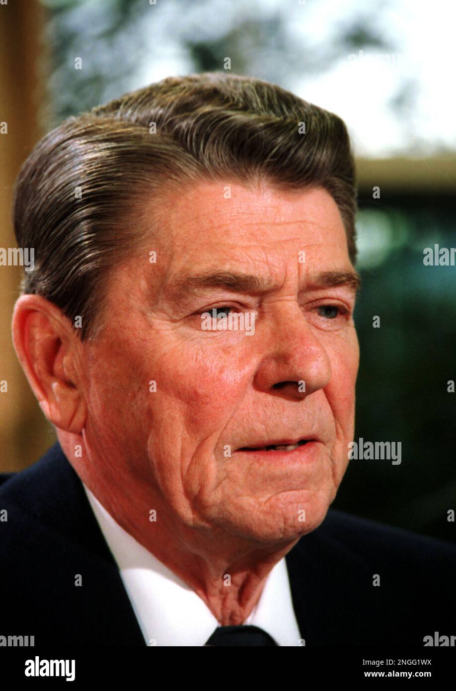 U.S. President Ronald Reagan is seen in the Oval Office at the White ...