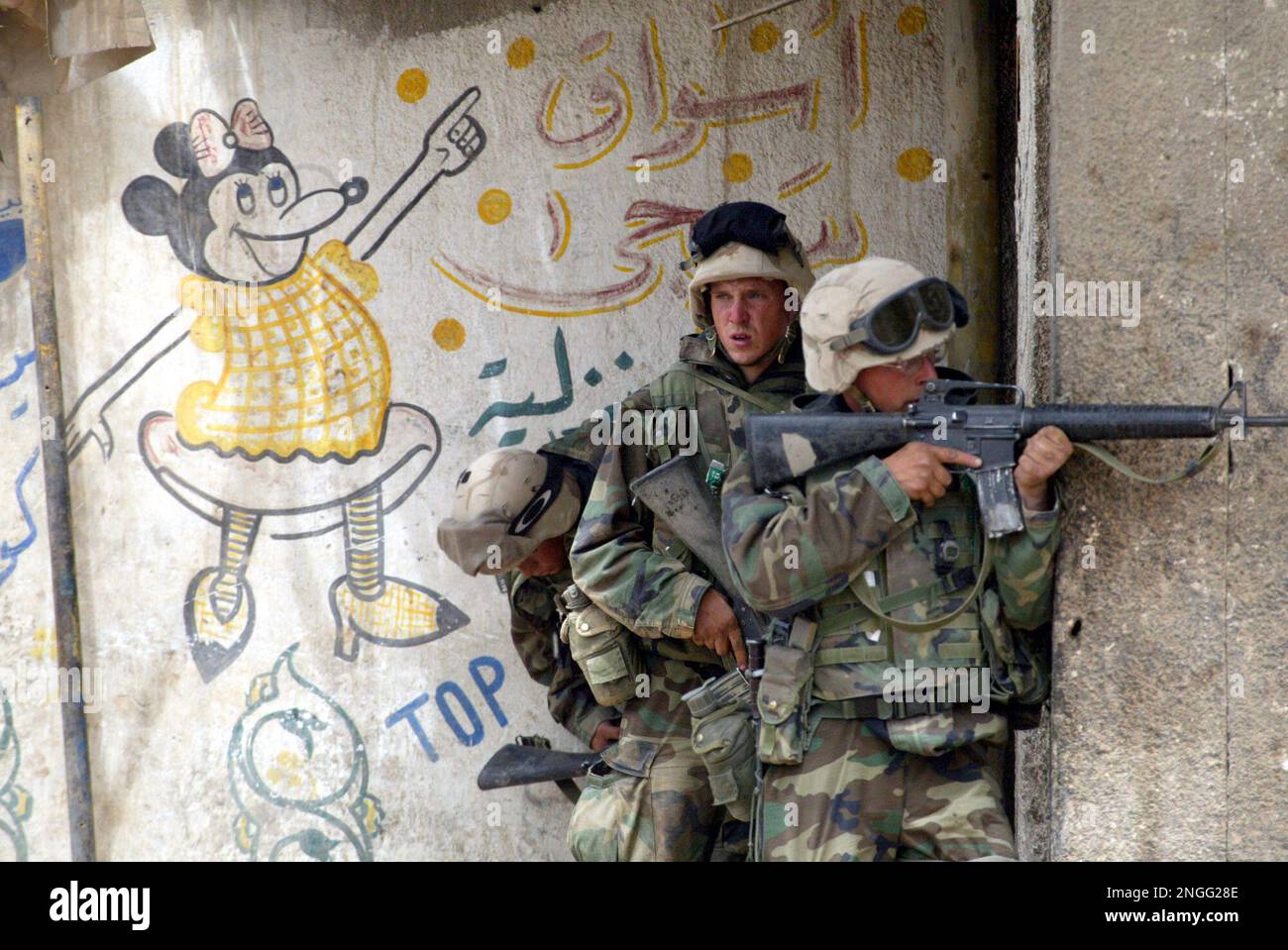 U.S. Marines from the 3rd battalion, 4th regiment, return fire during ...