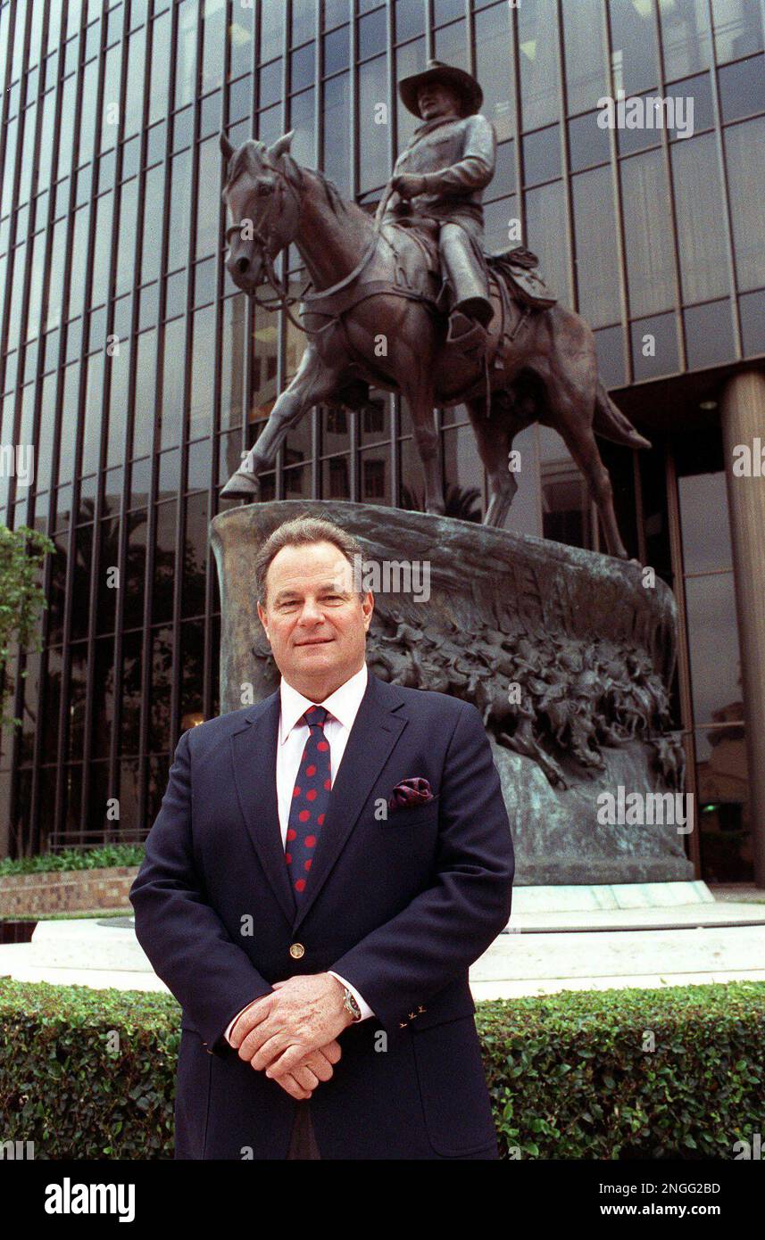 Michael Wayne stands beneath a statue of his father, actor John Wayne ...