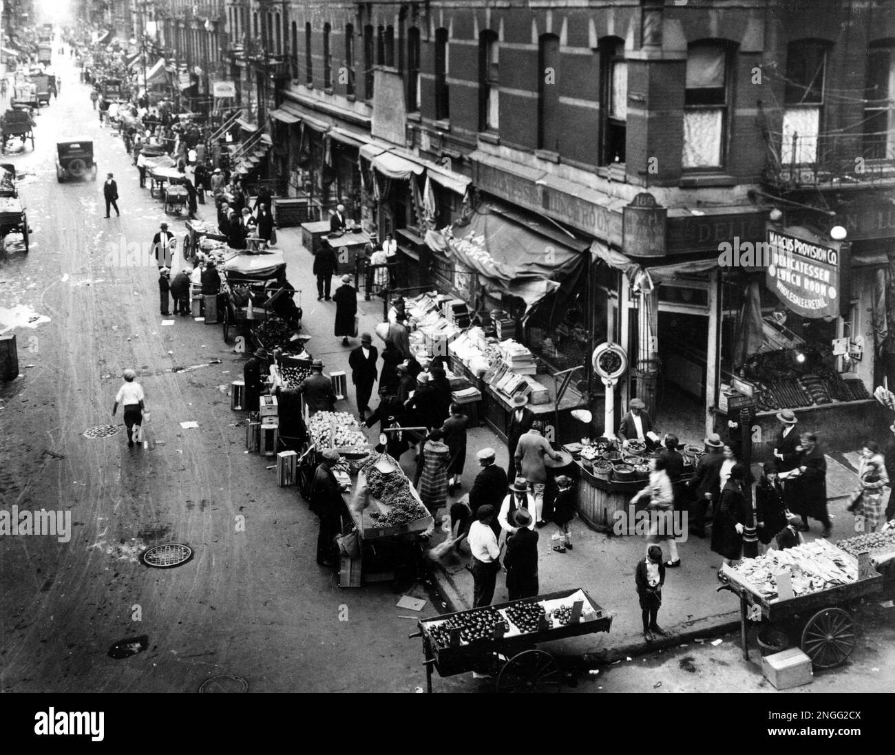 Pushcart peddlers sell their merchandise along the sidewalks of East ...