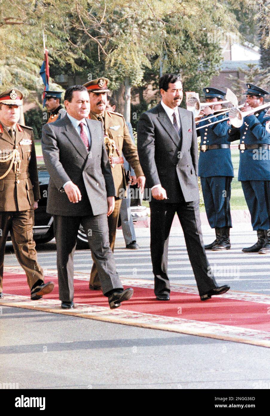 Iraqi President Saddam Hussein, right, walks with Egyptian President ...