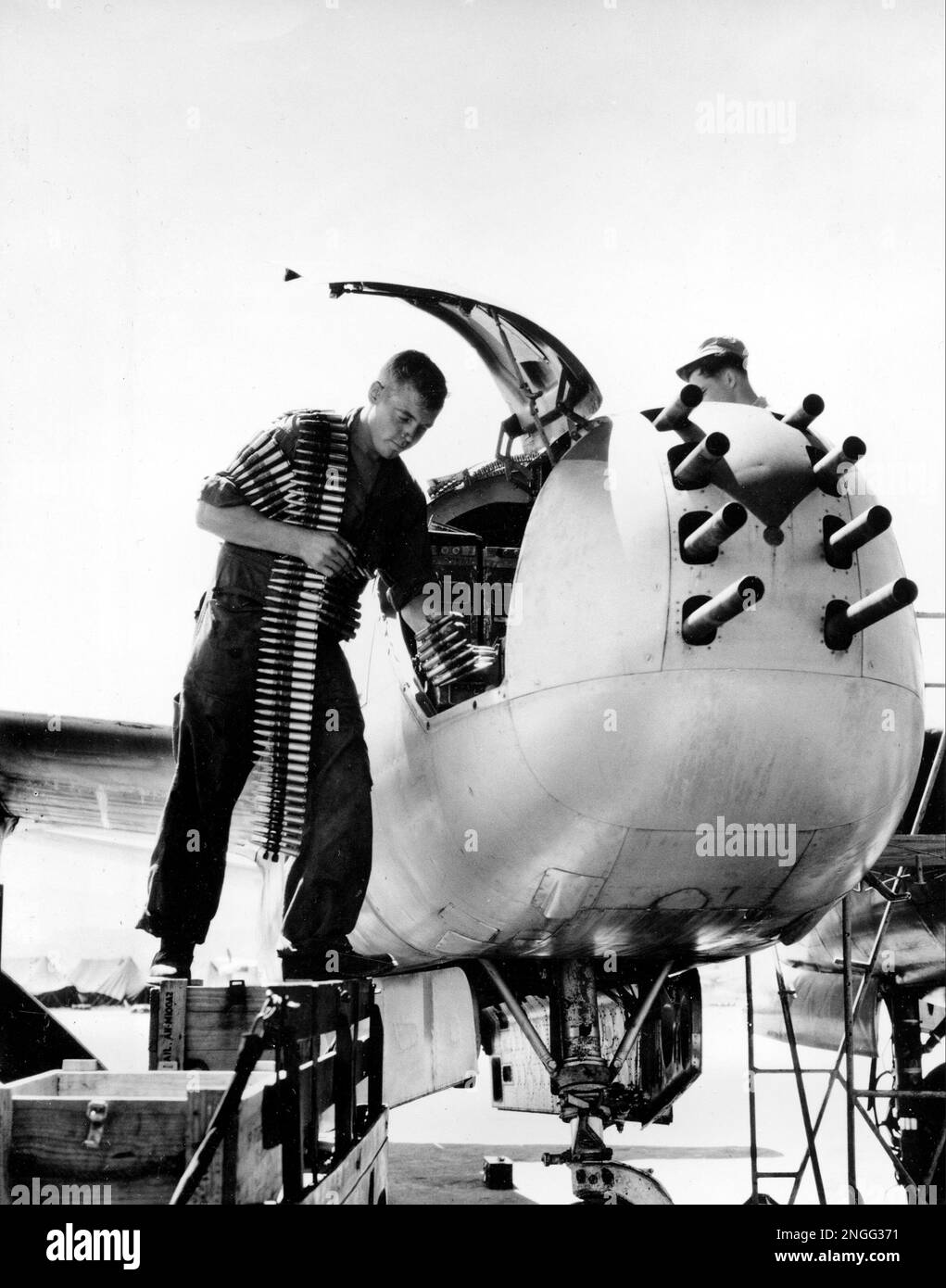 Cpl. J.C. Lovelace from Fowler, Ind., has draped a .50 caliber machine ...
