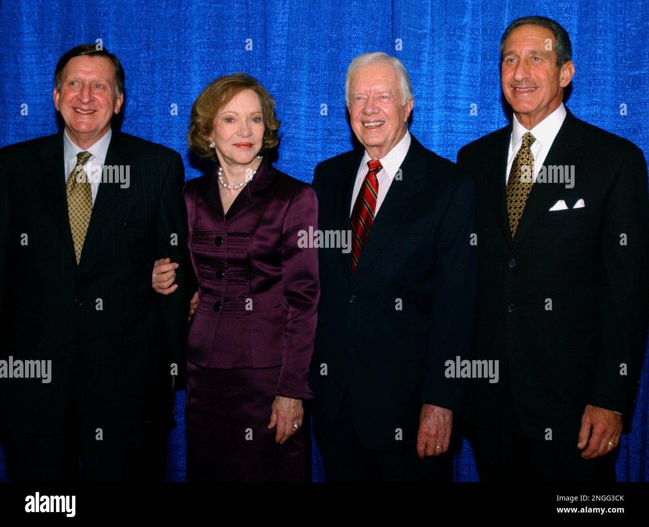 Former President Jimmy Carter, second from right, poses with his wife ...