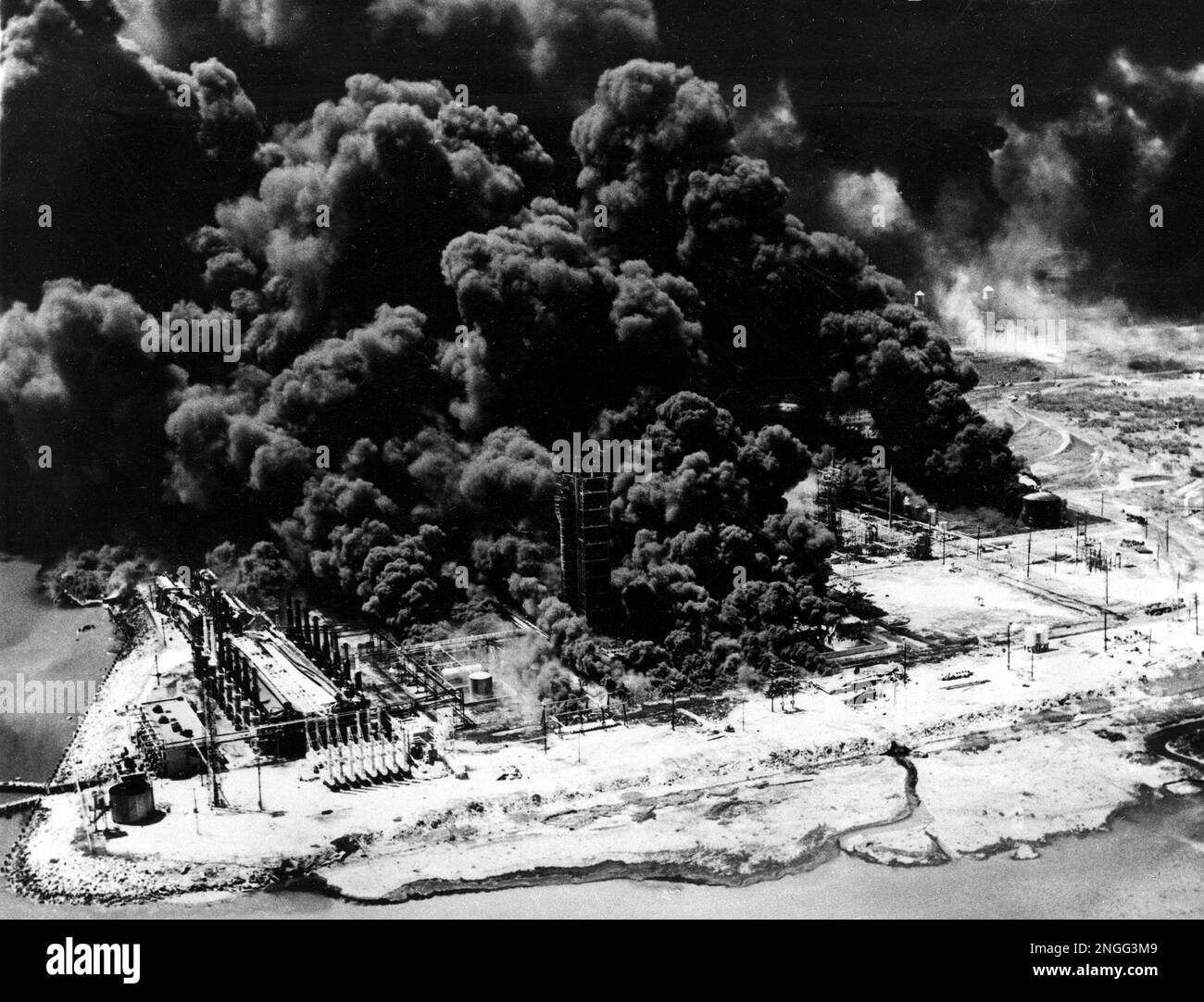 Thick columns of black smoke are rising from the fiercely burning ...