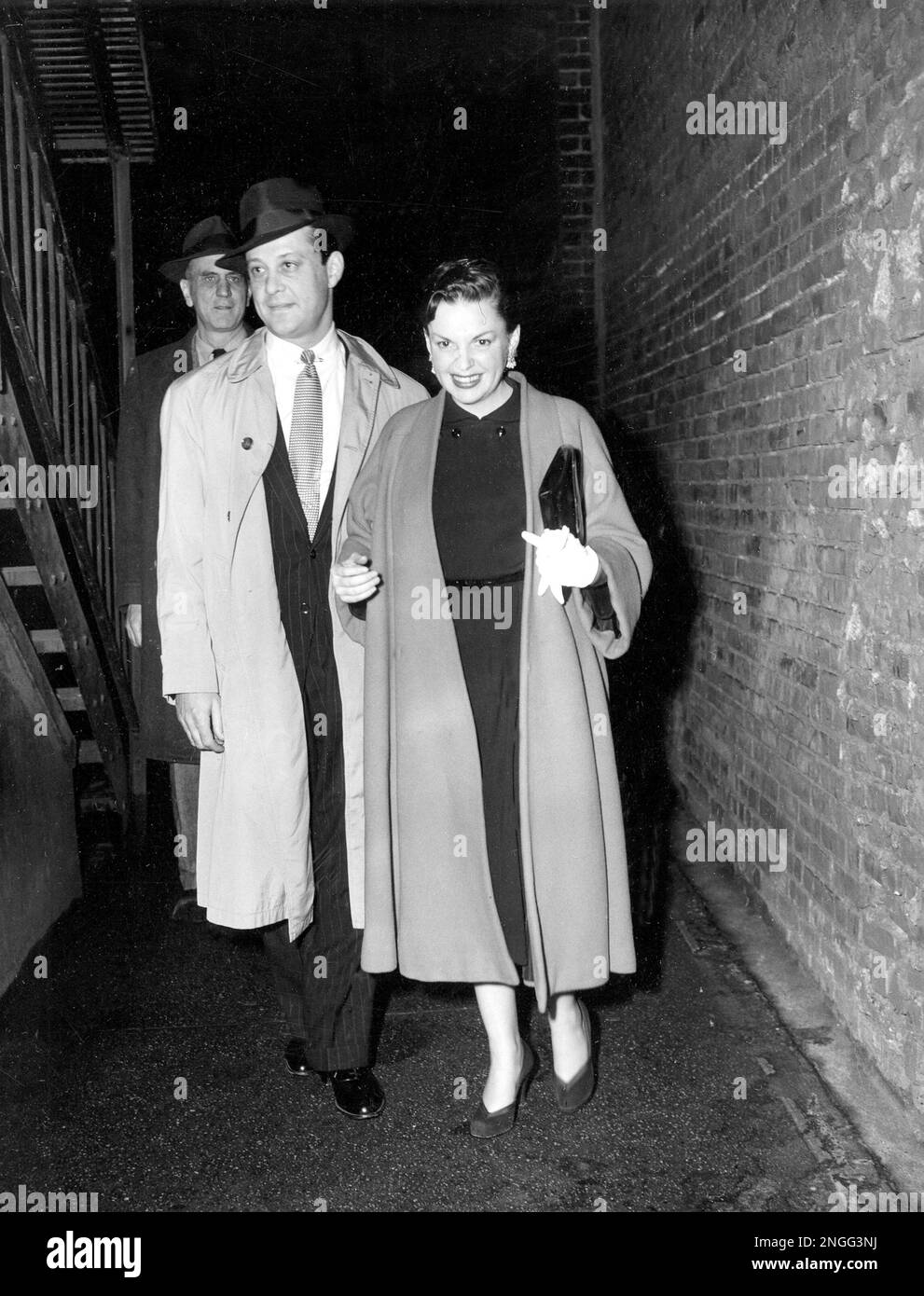 Actress-singer Judy Garland is accompanied by her manager and producer ...