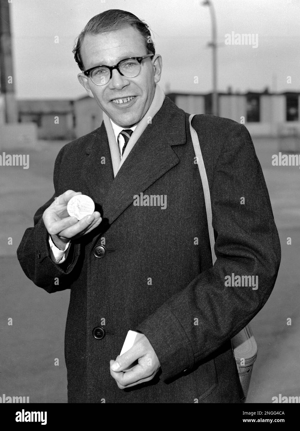 British middle-distance runner Chris Brasher holds his Olympic Gold ...