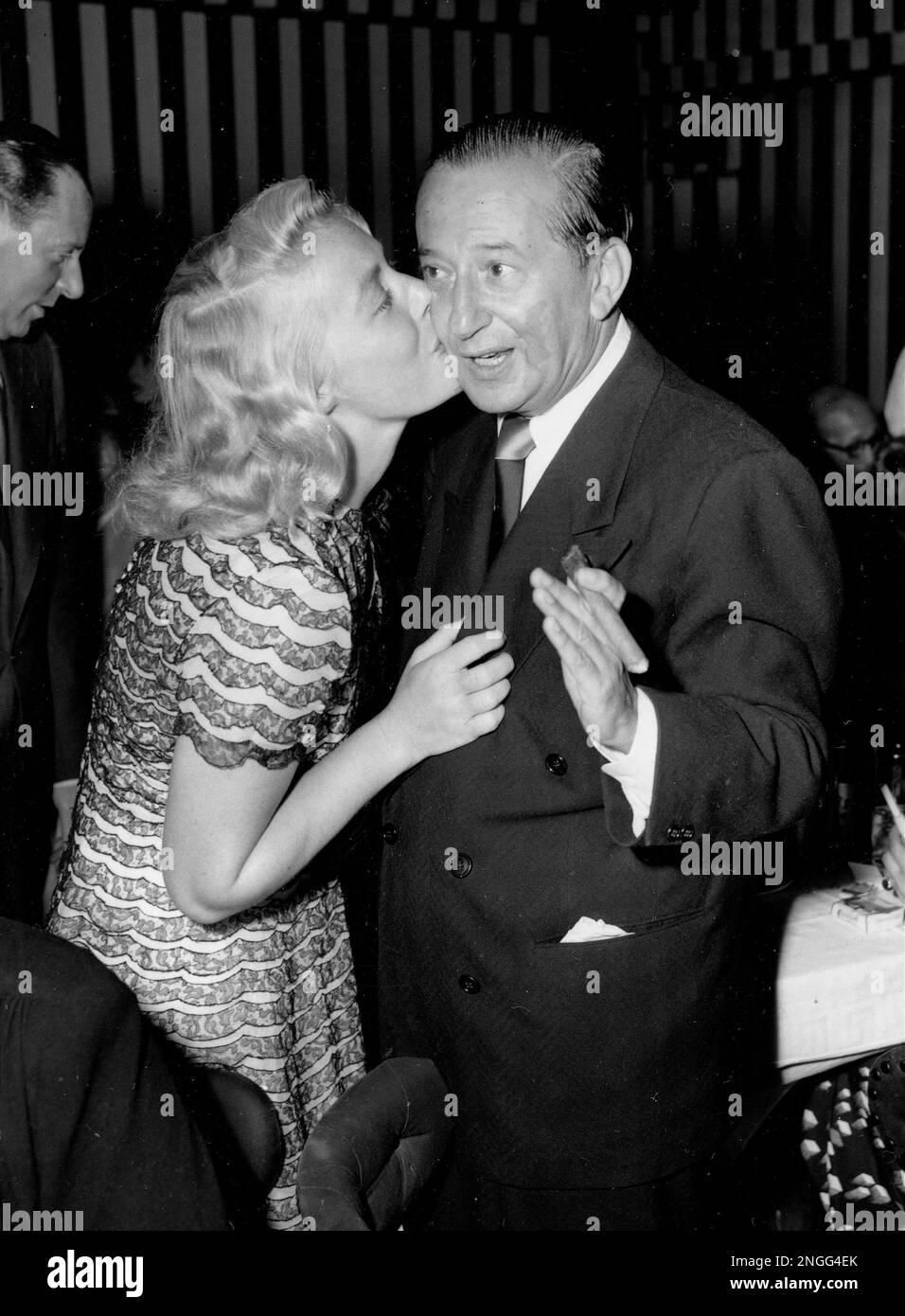 A smack that many movie fans would envy is given to comedian Lou Holtz ...