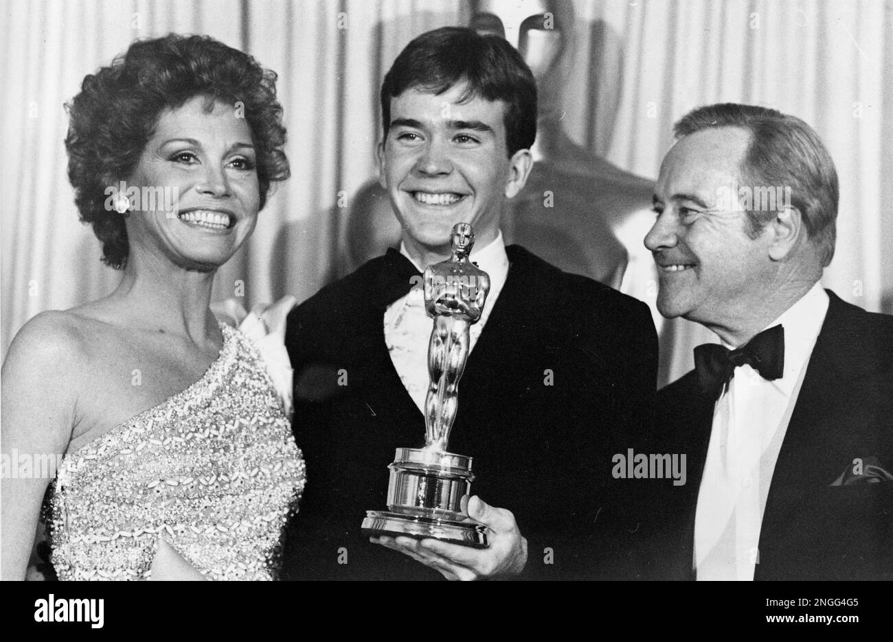 Timothy Hutton is presented with an Oscar as best supporting actor for ...