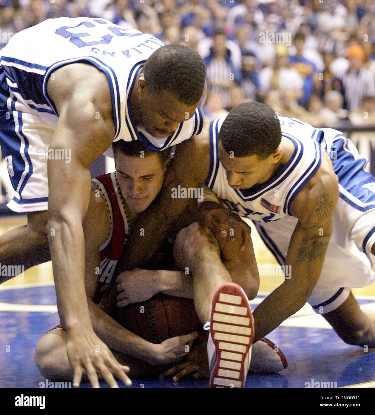 Maryland's Nik Caner-Medley, center, battles Duke's Shelden Williams ...