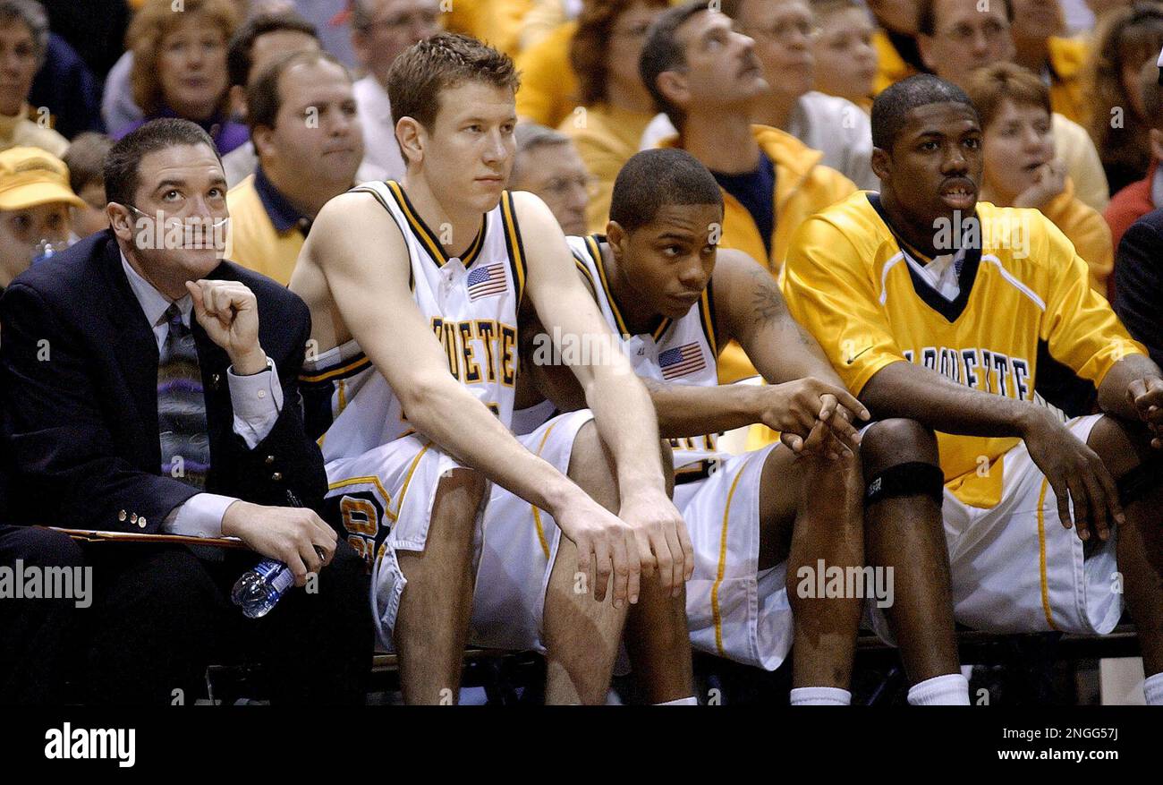 Marquette assistant coach Trey Schwab watches his team from the bench ...