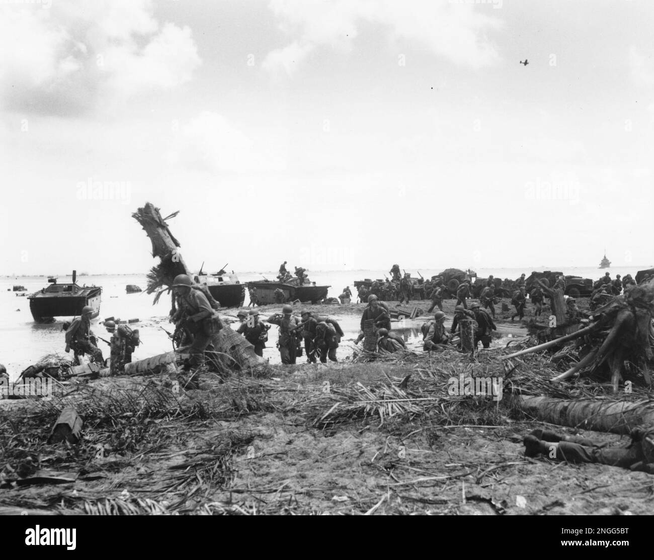 U.S. Marines disembark from landing craft as they reach the shore at ...