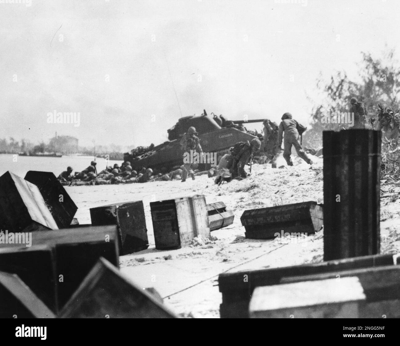 U.S. Marines, supported by amphibious tanks, establish a beachhead ...