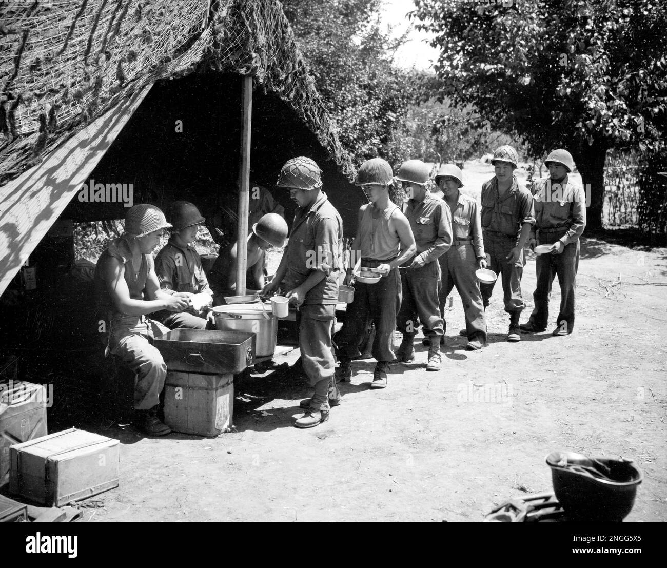 Japanese-Americans, members of the 442 Combat team, line up for food on ...