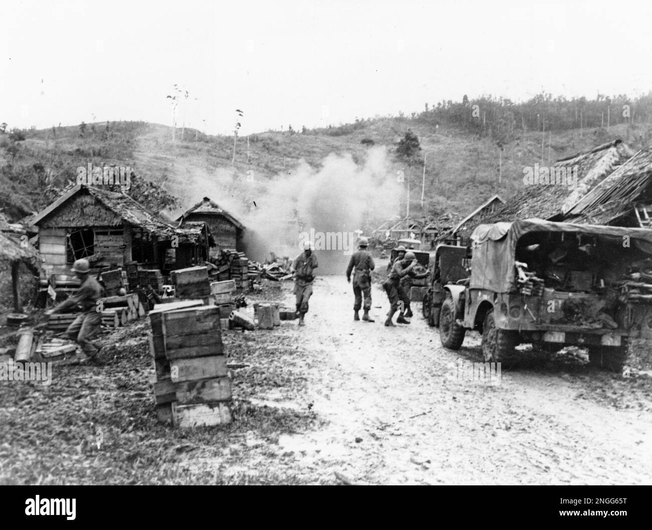 Japanese 90mm mortar shells explode amid a unit of U.S. Marines, as ...