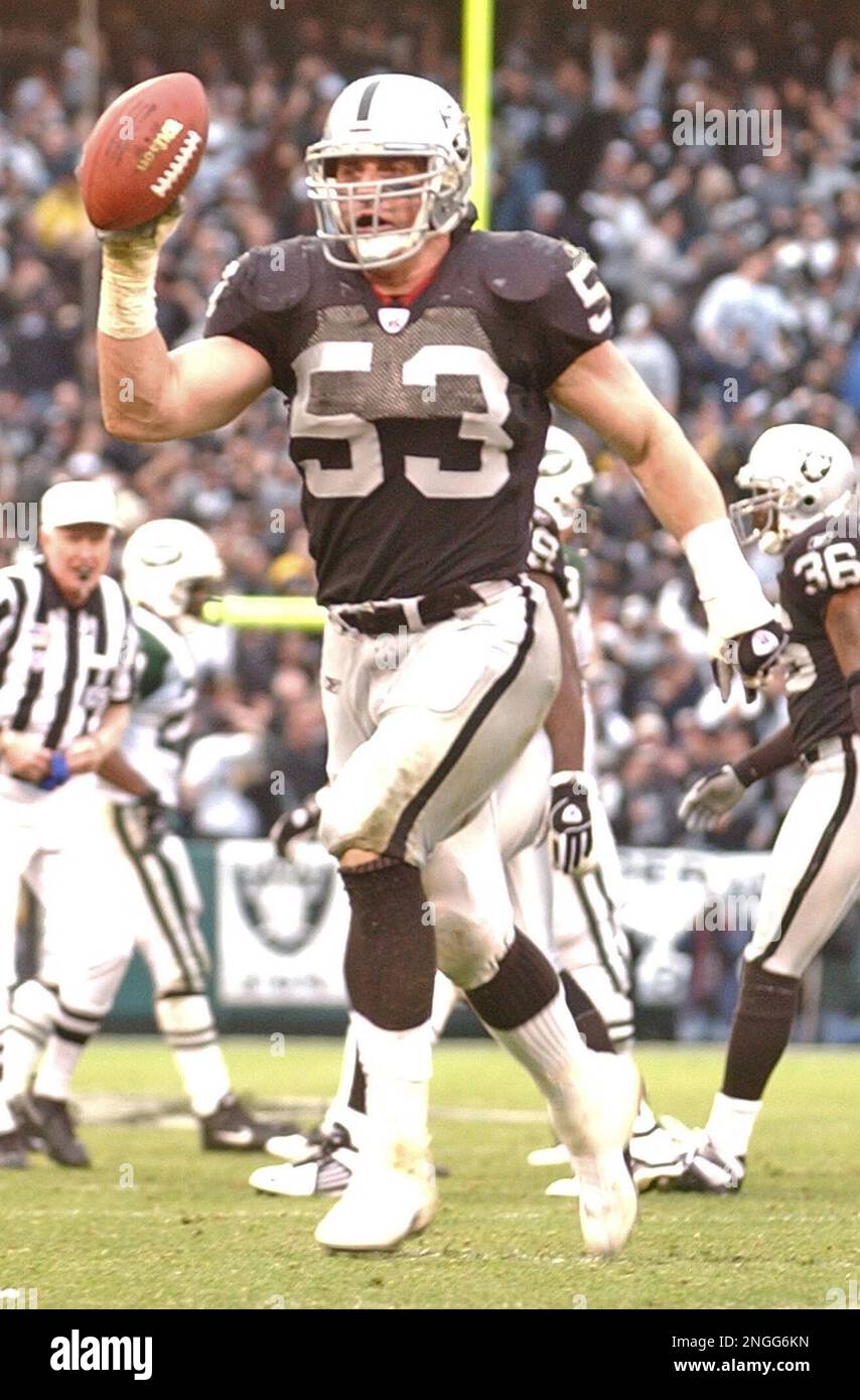 Oakland Raiders linebacker Bill Romanowski runs with the football after ...