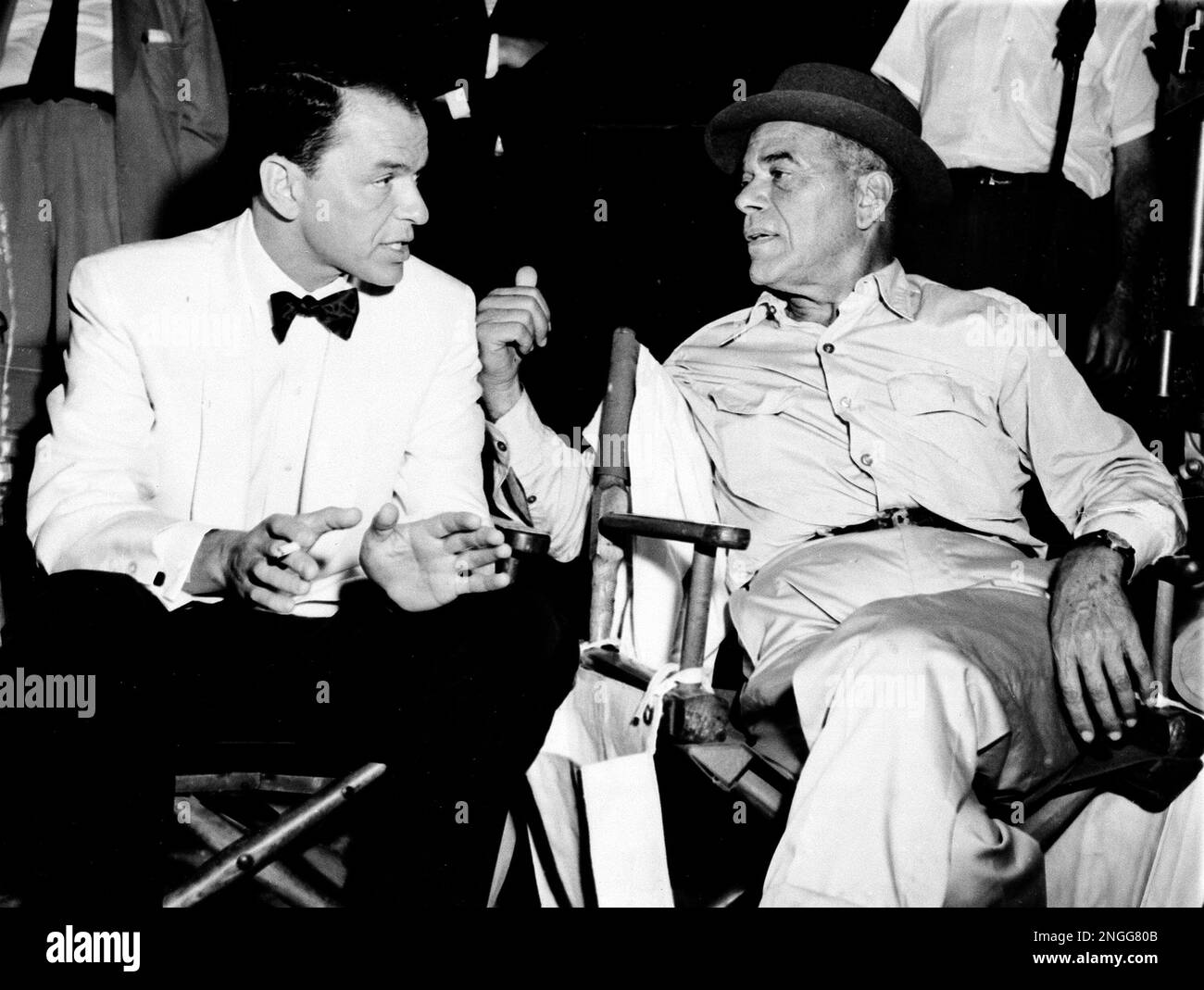 Director Frank Capra, right, talks with actor Frank Sinatra during ...