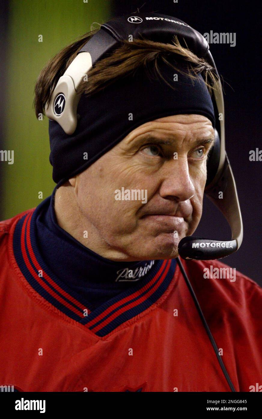 New England Patriots coach Bill Belichick listens on his headset late ...