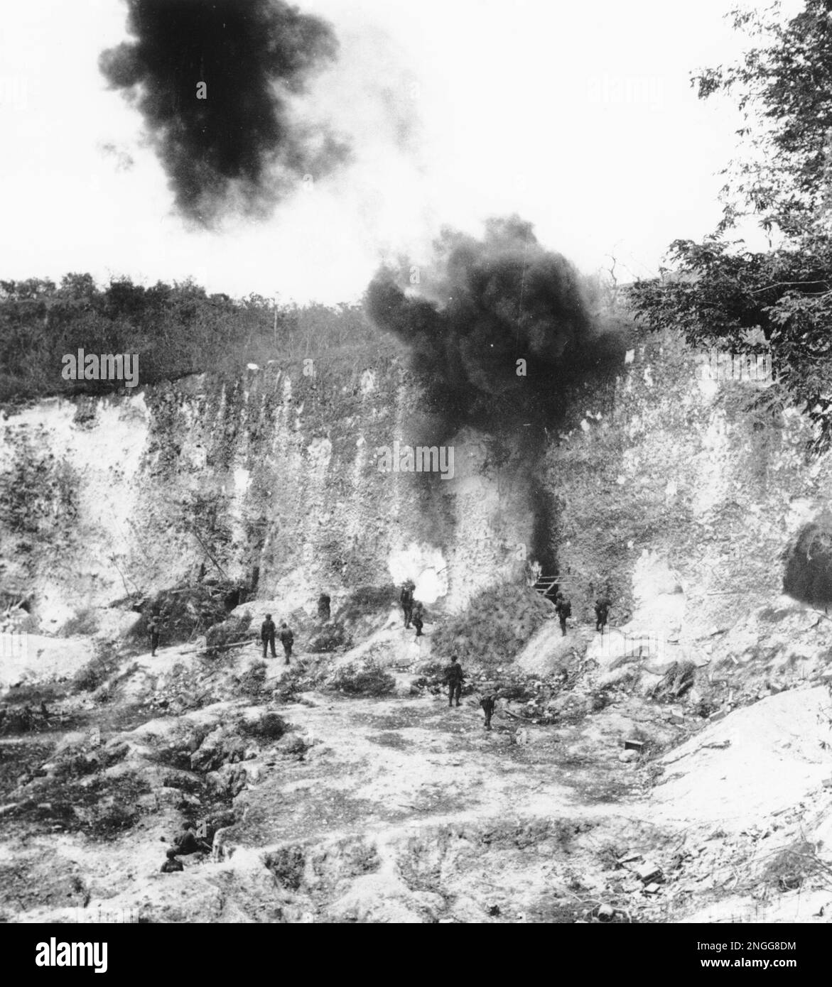 A U.S. Marine demolition crew uses flamethrowers to destroy a Japanese ...