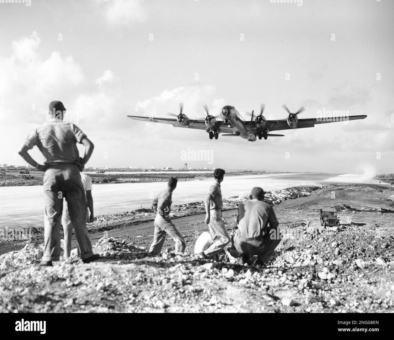 U.S. soldiers at the Saipan airbase, in the Mariana Islands, watch as a ...