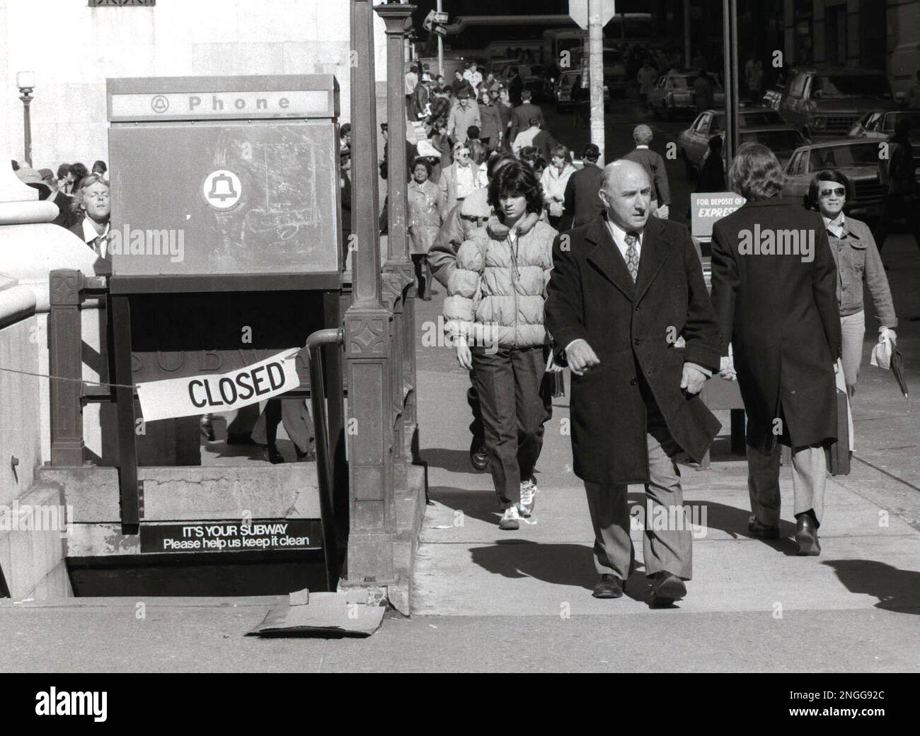 New Yorkers pass a closed subway entrance on April 1, 1980, during the ...