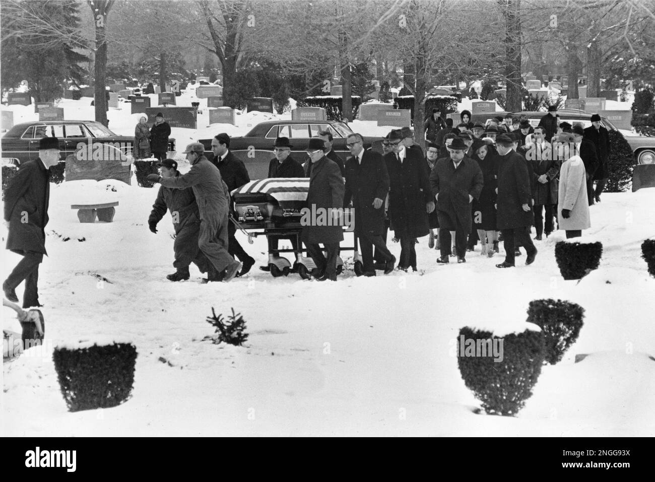 Pallbearers, followed by family and friends, trundle the casket of Jack ...