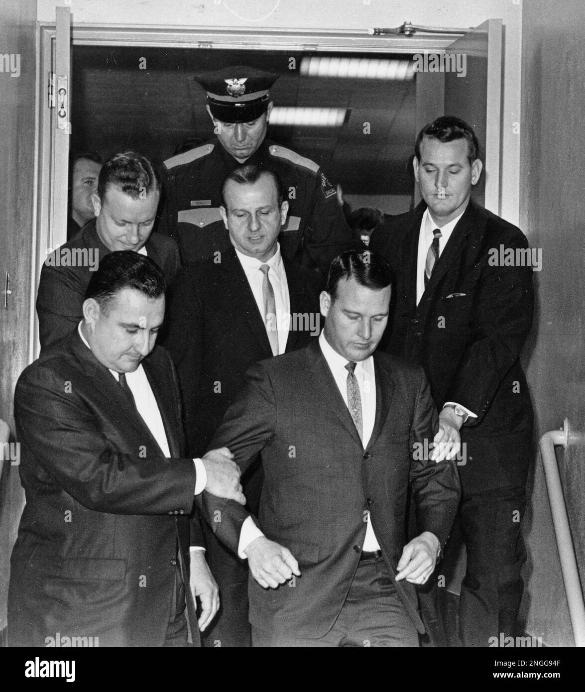 Jack Ruby, center, is surrounded by sheriff's deputies as he is ...