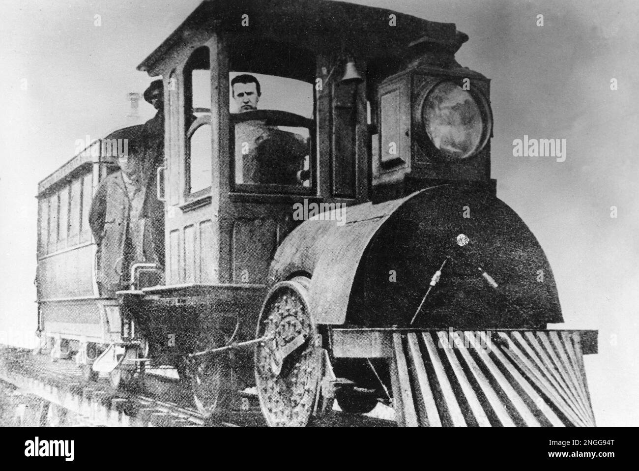 Thomas Edison is seen at the throttle of an electric locomotive built ...