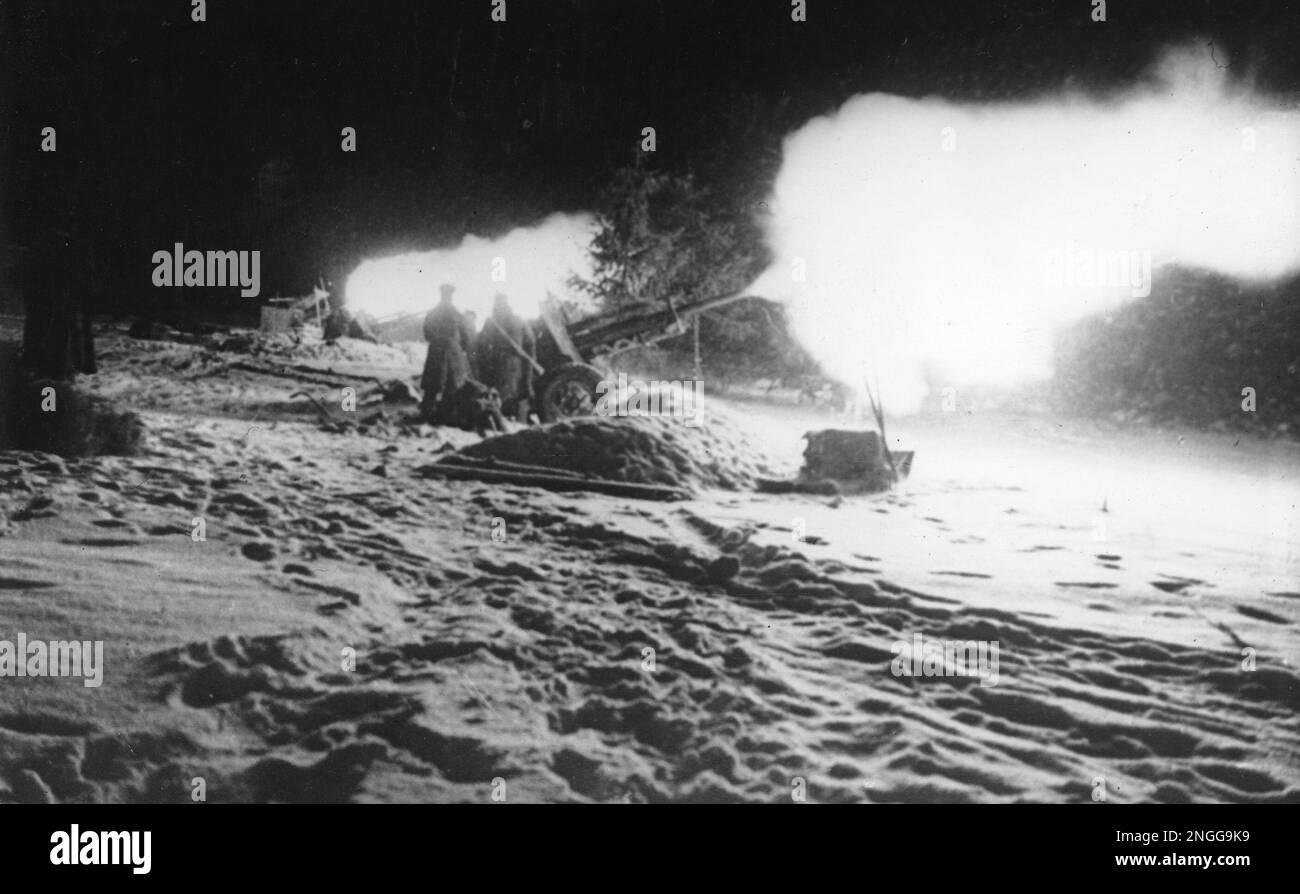 Soviet Red Army soldiers are seen as they fire their artillery gun at ...