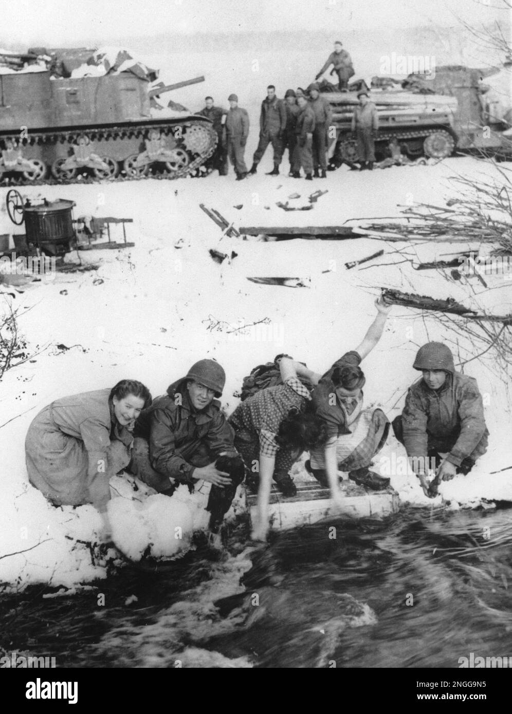 Belgian girls and American soldiers of an armored division share a ...