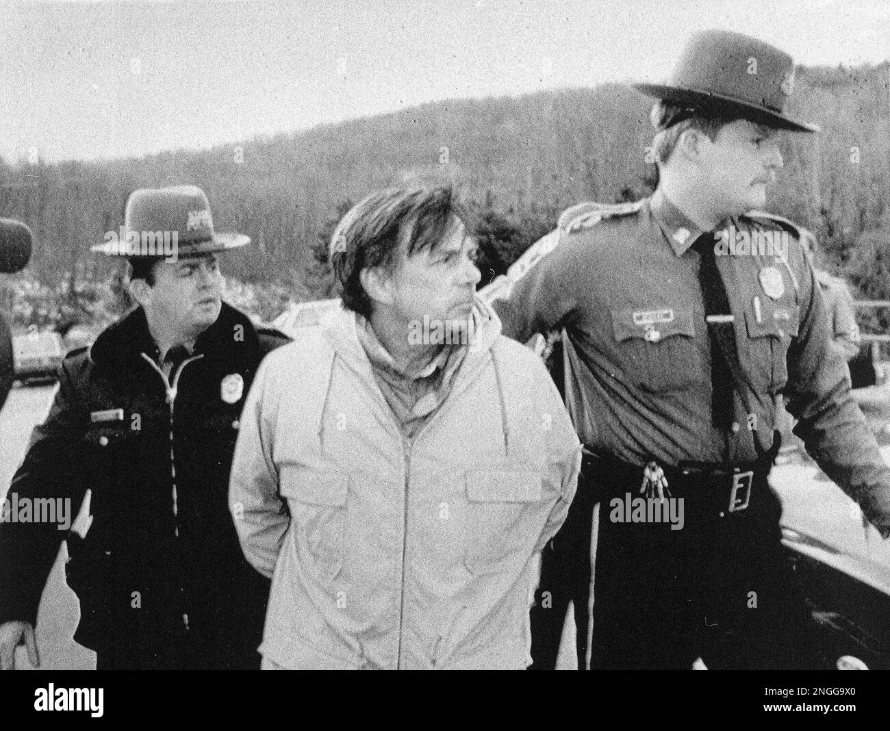 Richard Crafts of Newton, Conn., is escorted by state police officers ...