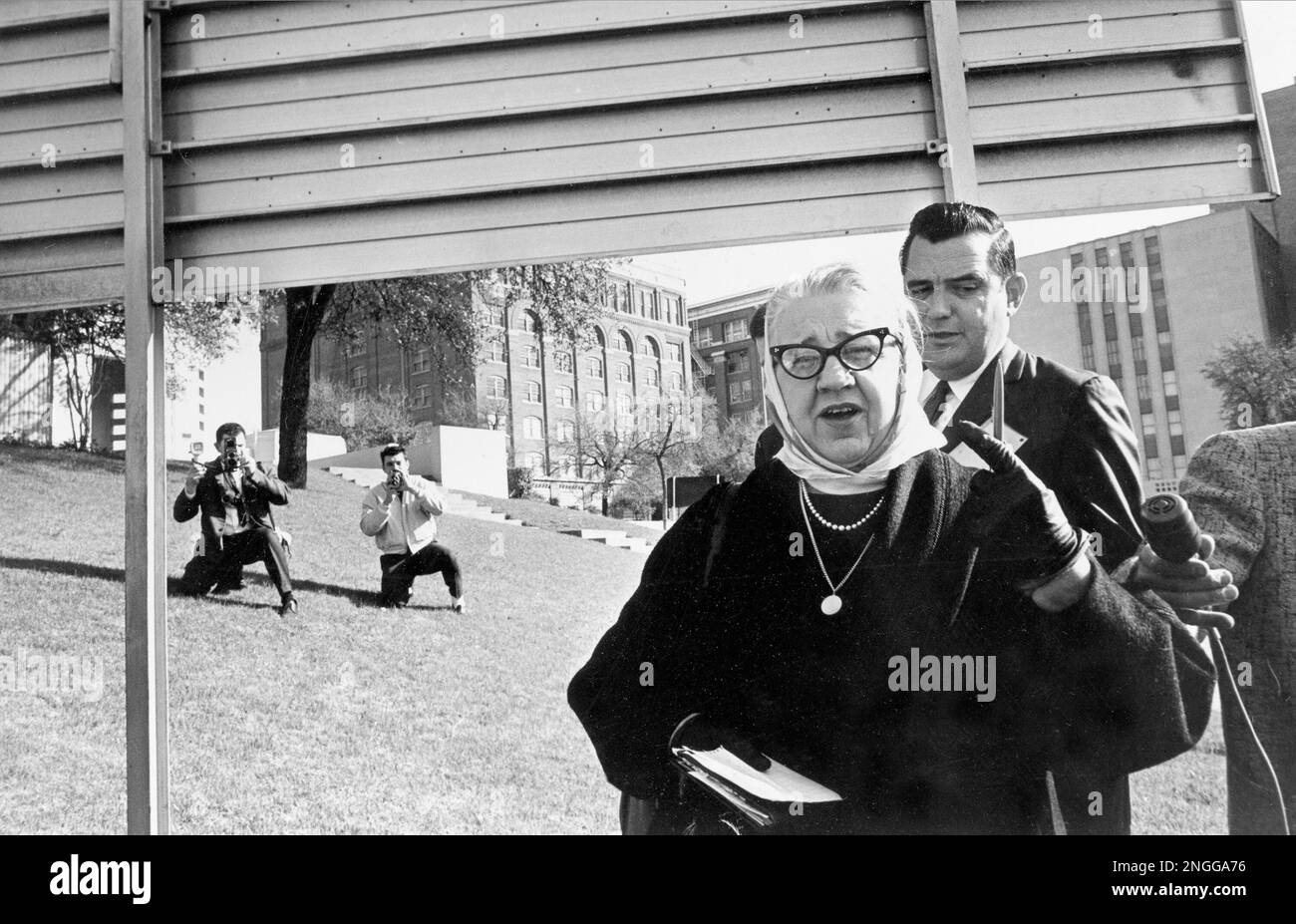 Marguerite Oswald talks to reporters during her visit to the site where ...