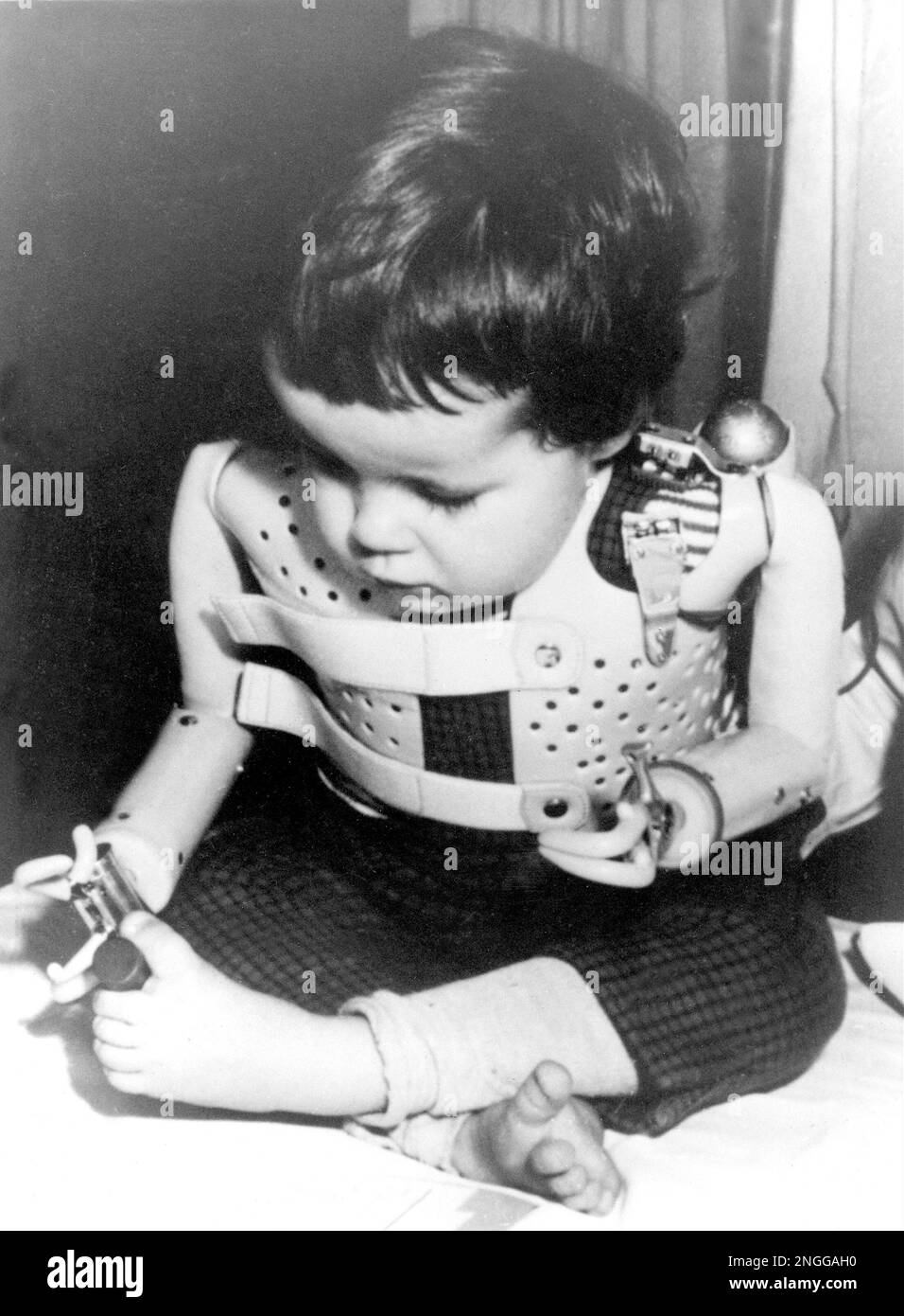 A three-year-old girl, born without arms to a German mother who took ...