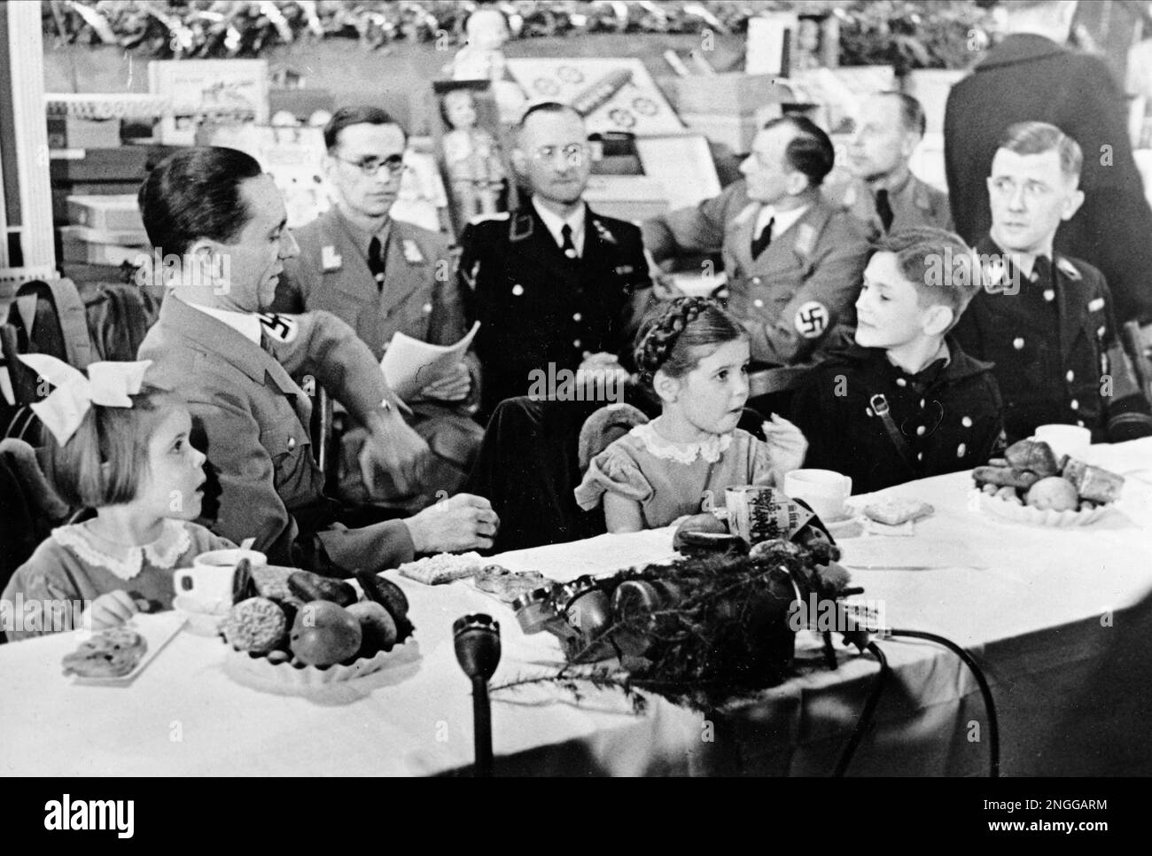 Joseph Goebbels, German propaganda minister, left, is shown with two of ...